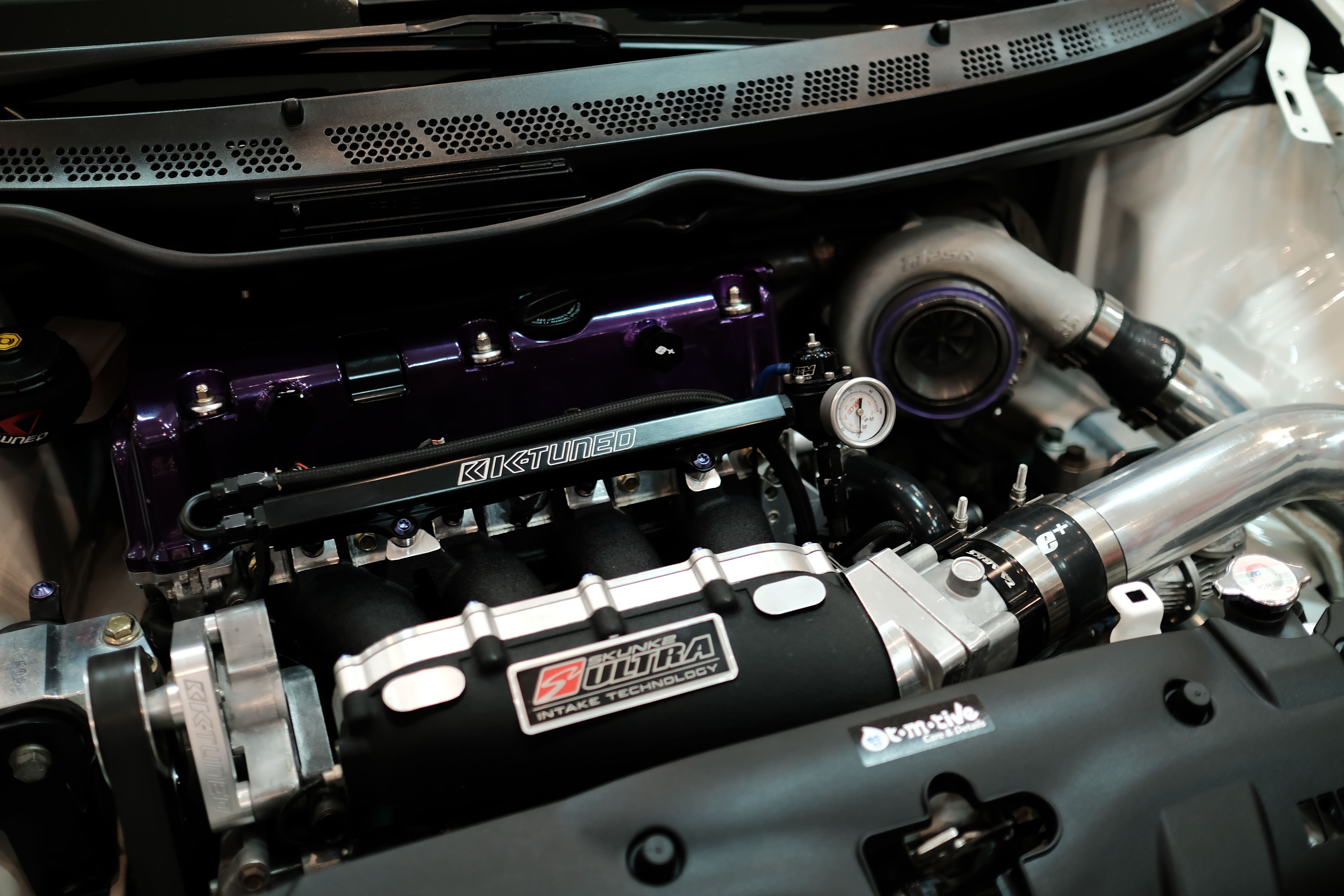 A close up of the engine bay of a car · Free Stock Photo