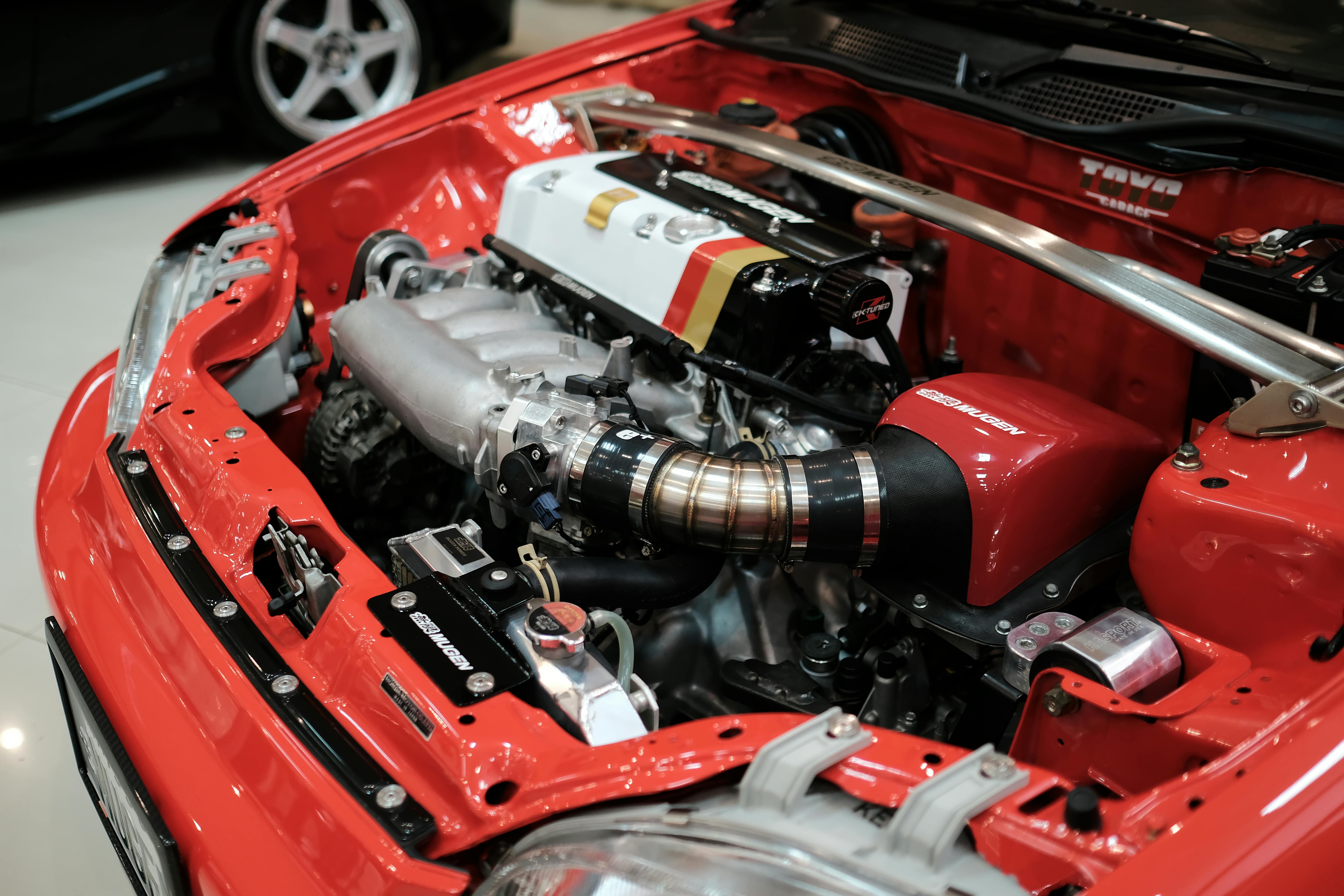 Engine Inside of a Red Honda · Free Stock Photo