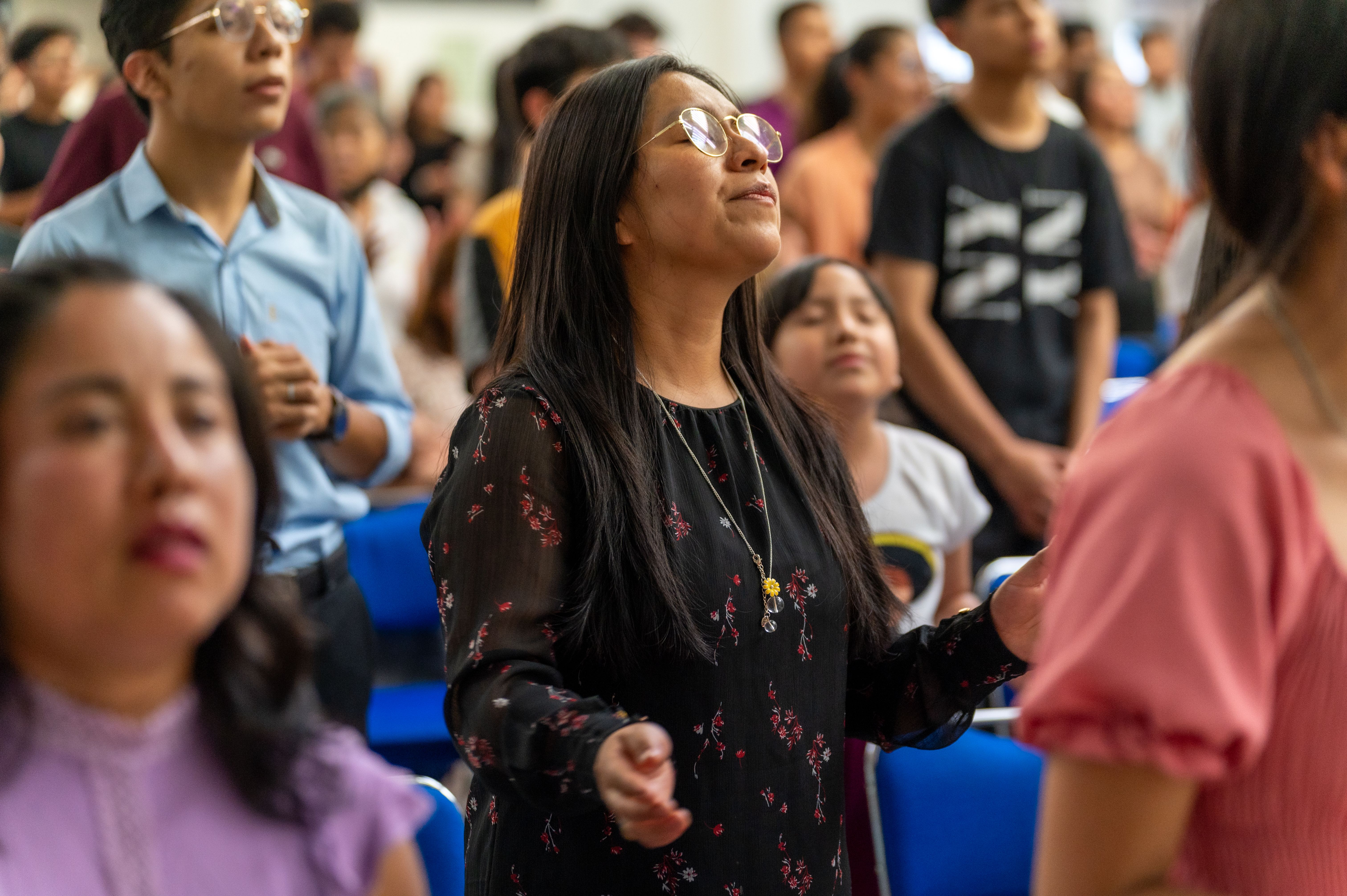 Woman Praying in a Church · Free Stock Photo