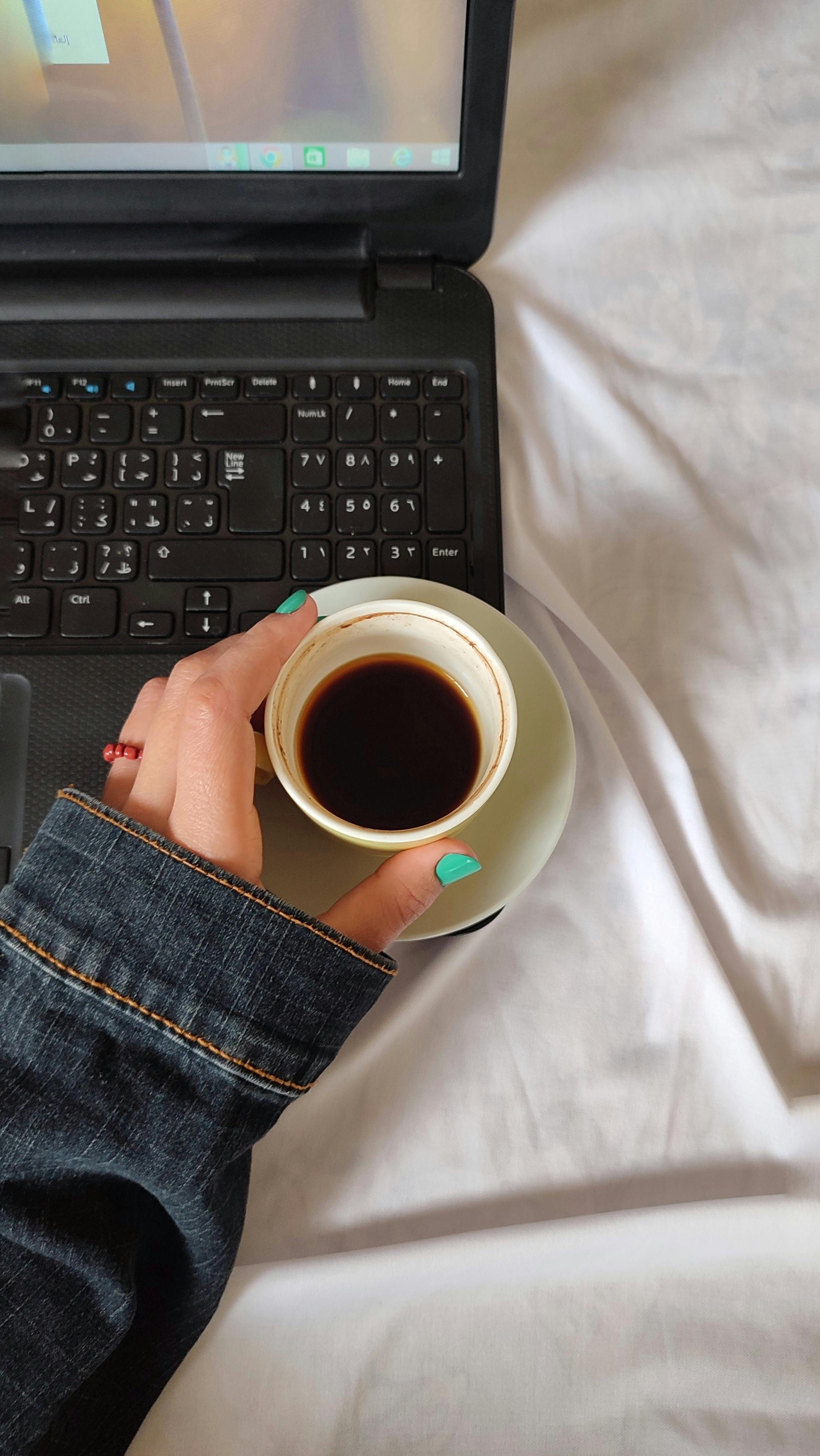 Cup of Coffee on Laptop · Free Stock Photo