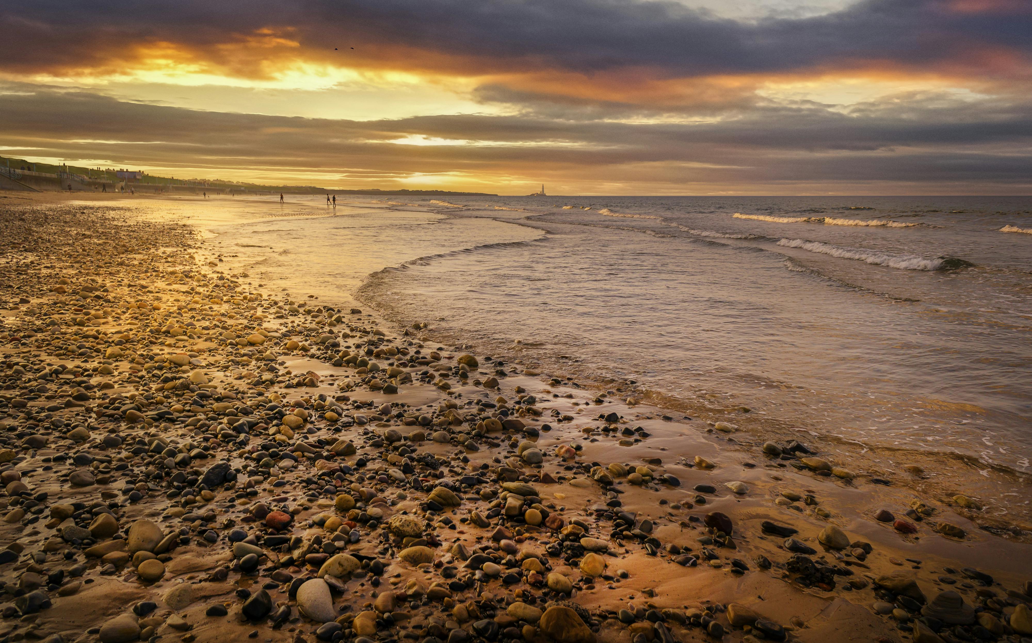 People Walking on the Beach at Sunset · Free Stock Photo