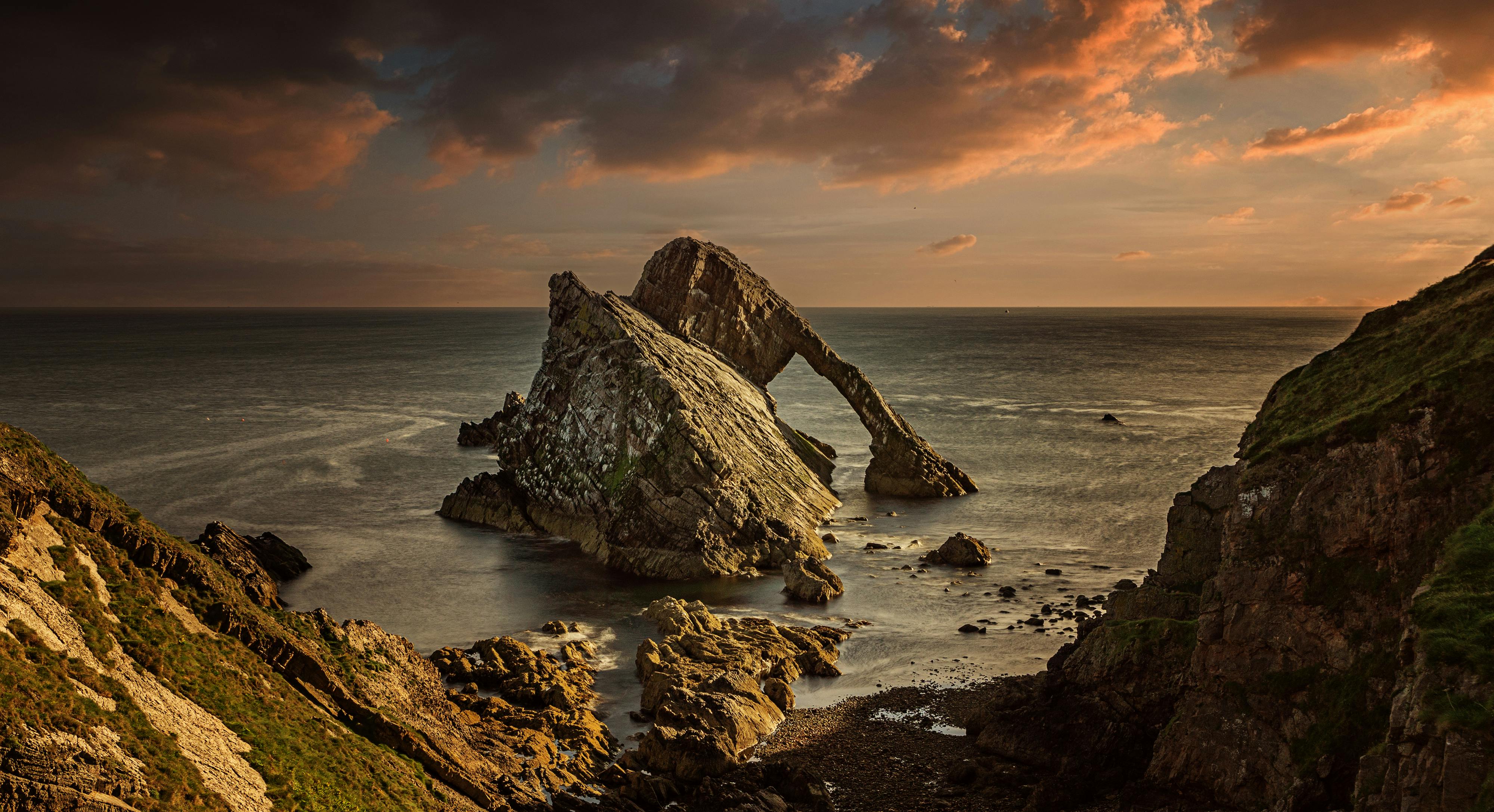View of the Bow Fiddle Rock at Sunset, Portknockie, Scotland · Free ...