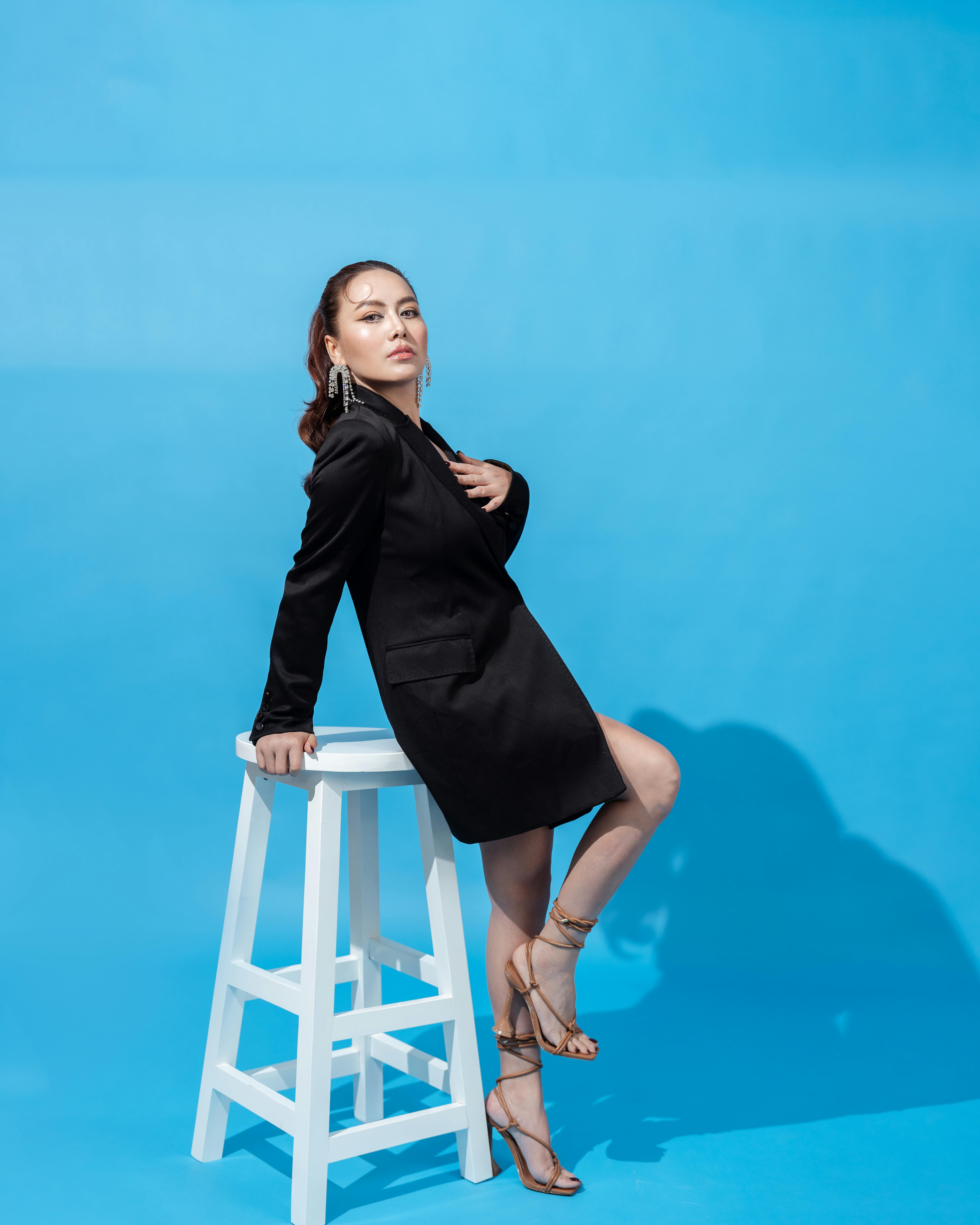 Woman in Black Skirt Suit Leaning on Stool · Free Stock Photo