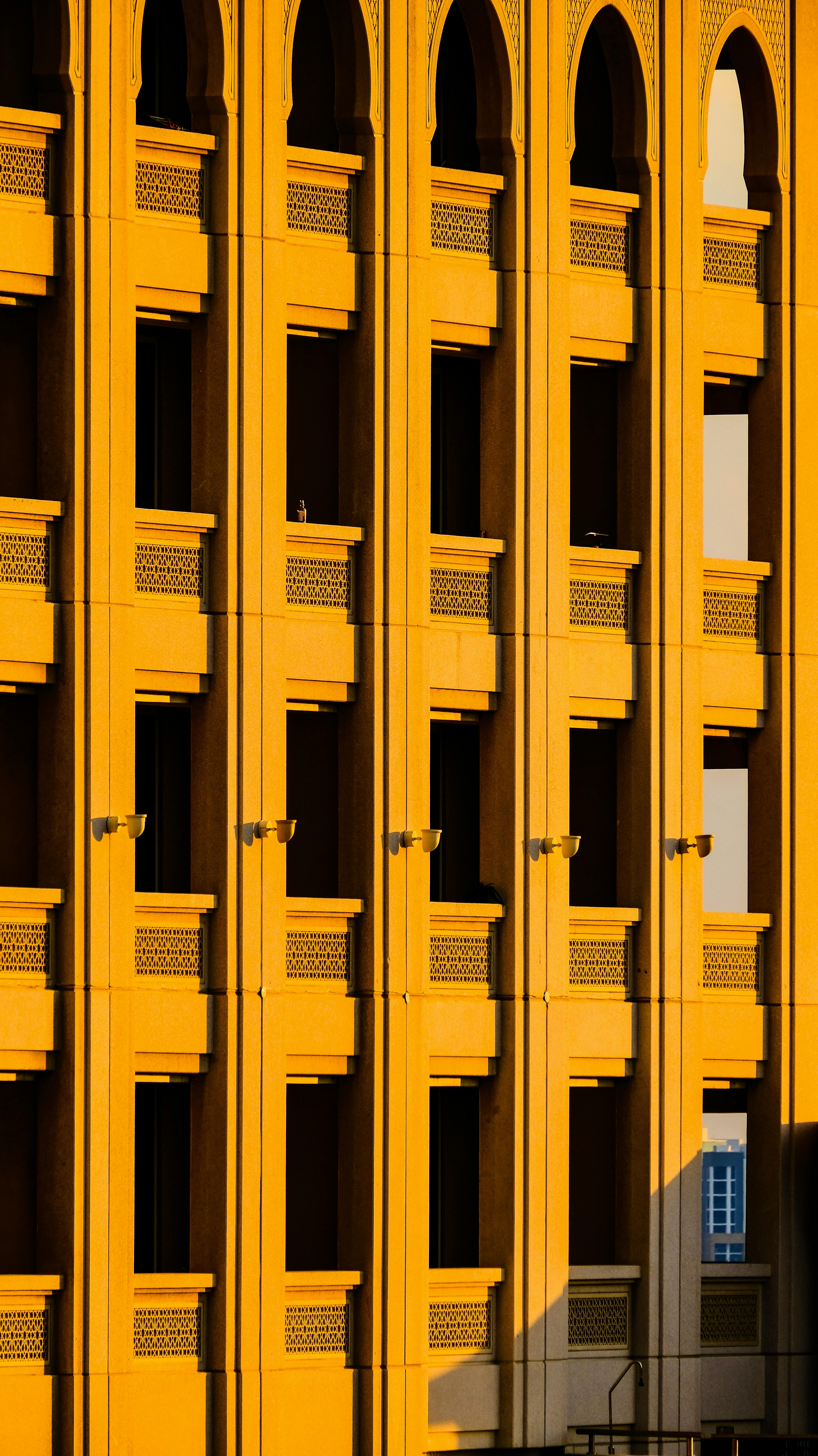 Geometric Repetitive Yellow Exterior Facade of Building · Free Stock Photo