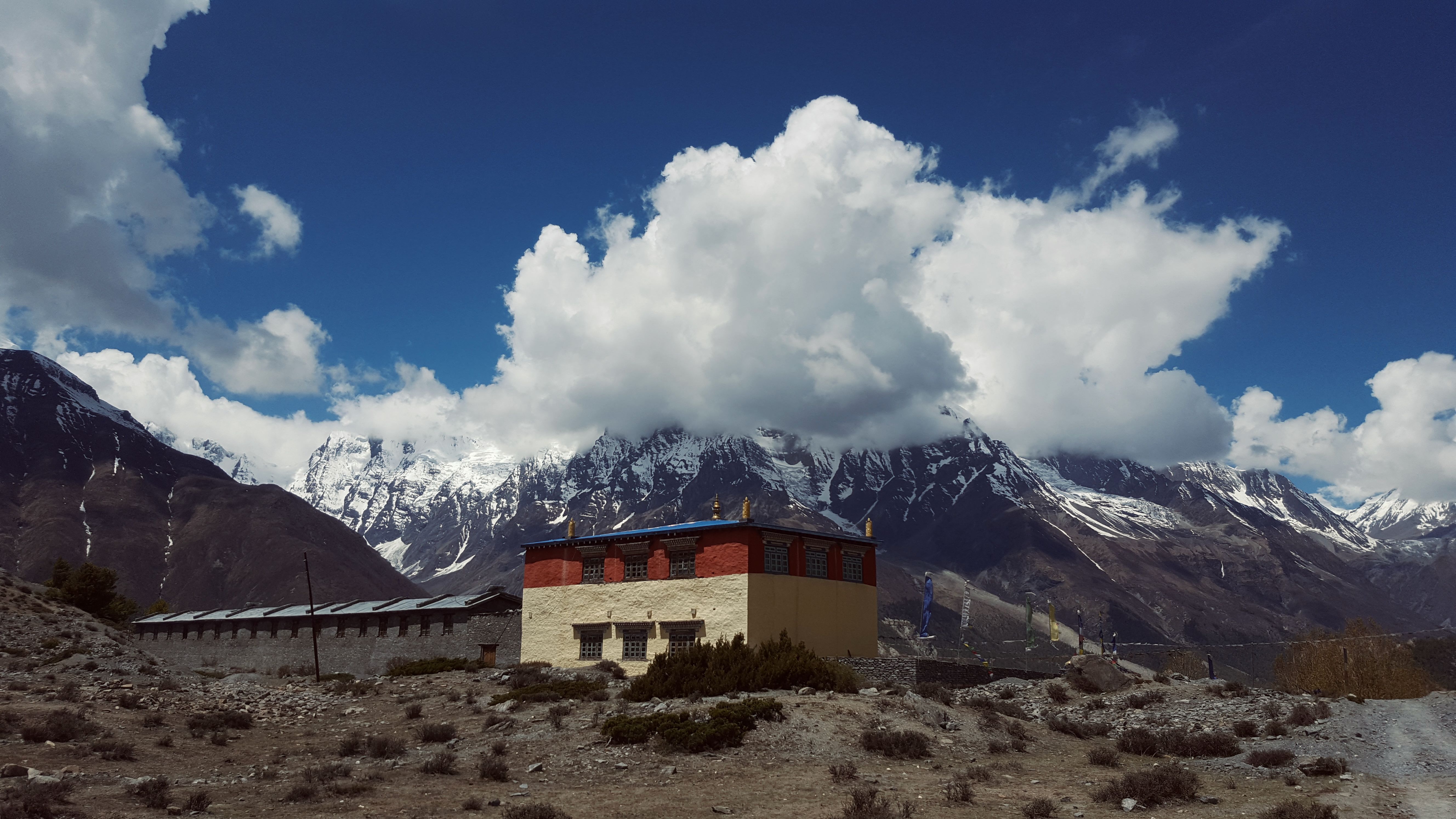 A Monastery Building at the Foot of Snowcapped Mountains near Manang ...