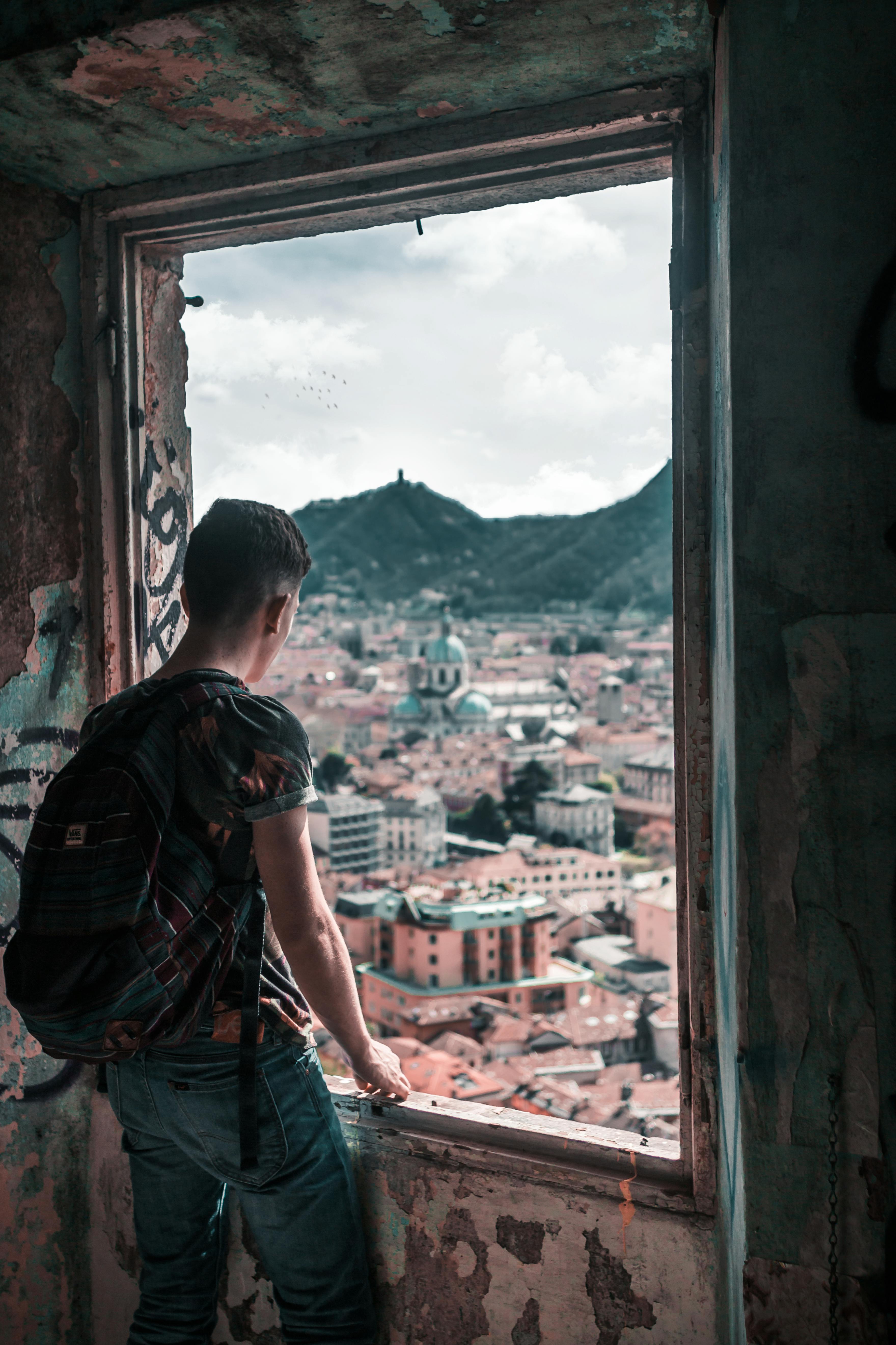 Man Standing Beside Window · Free Stock Photo