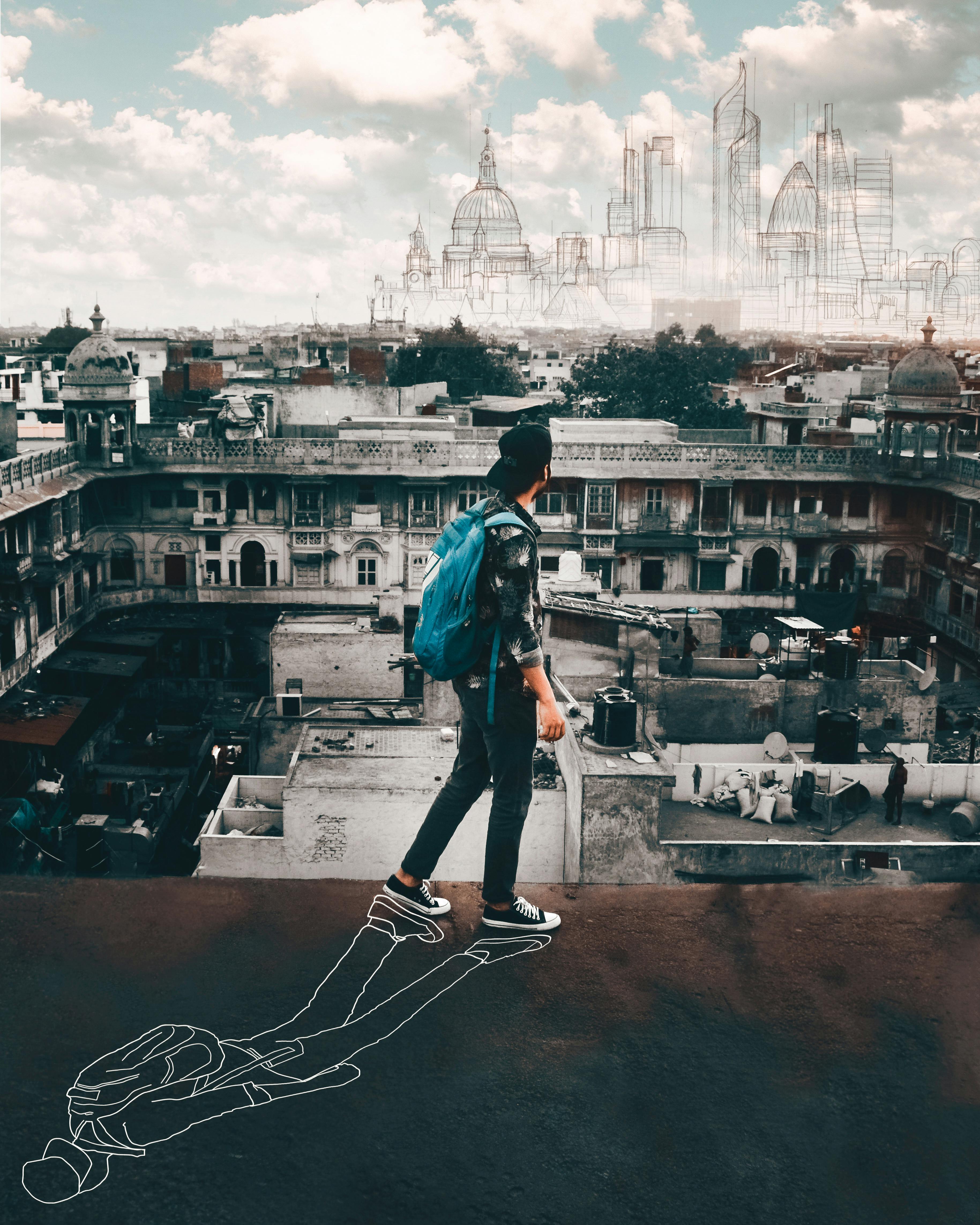 Person Standing on Building Top · Free Stock Photo