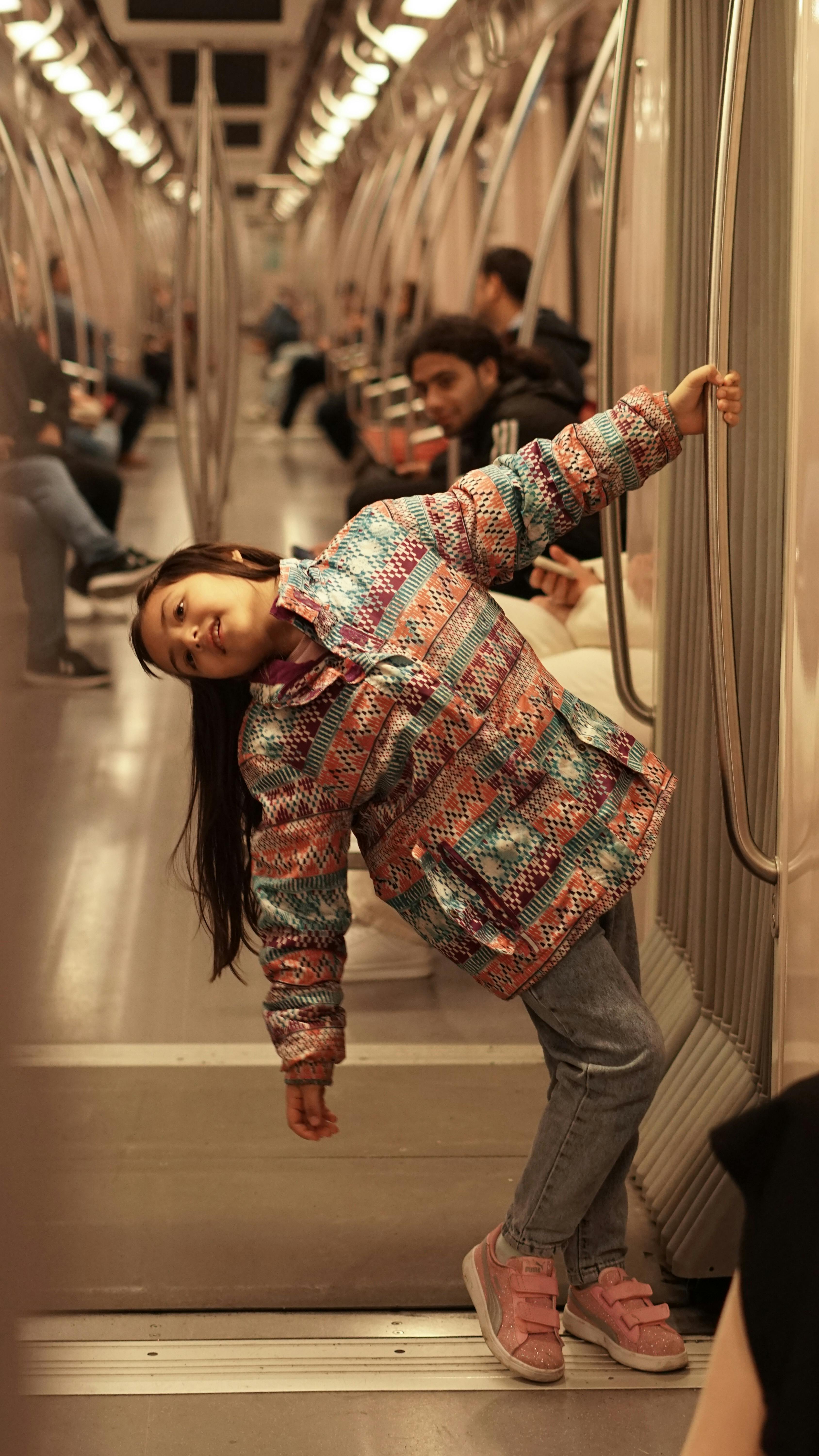 Little Girl Riding a Subway · Free Stock Photo