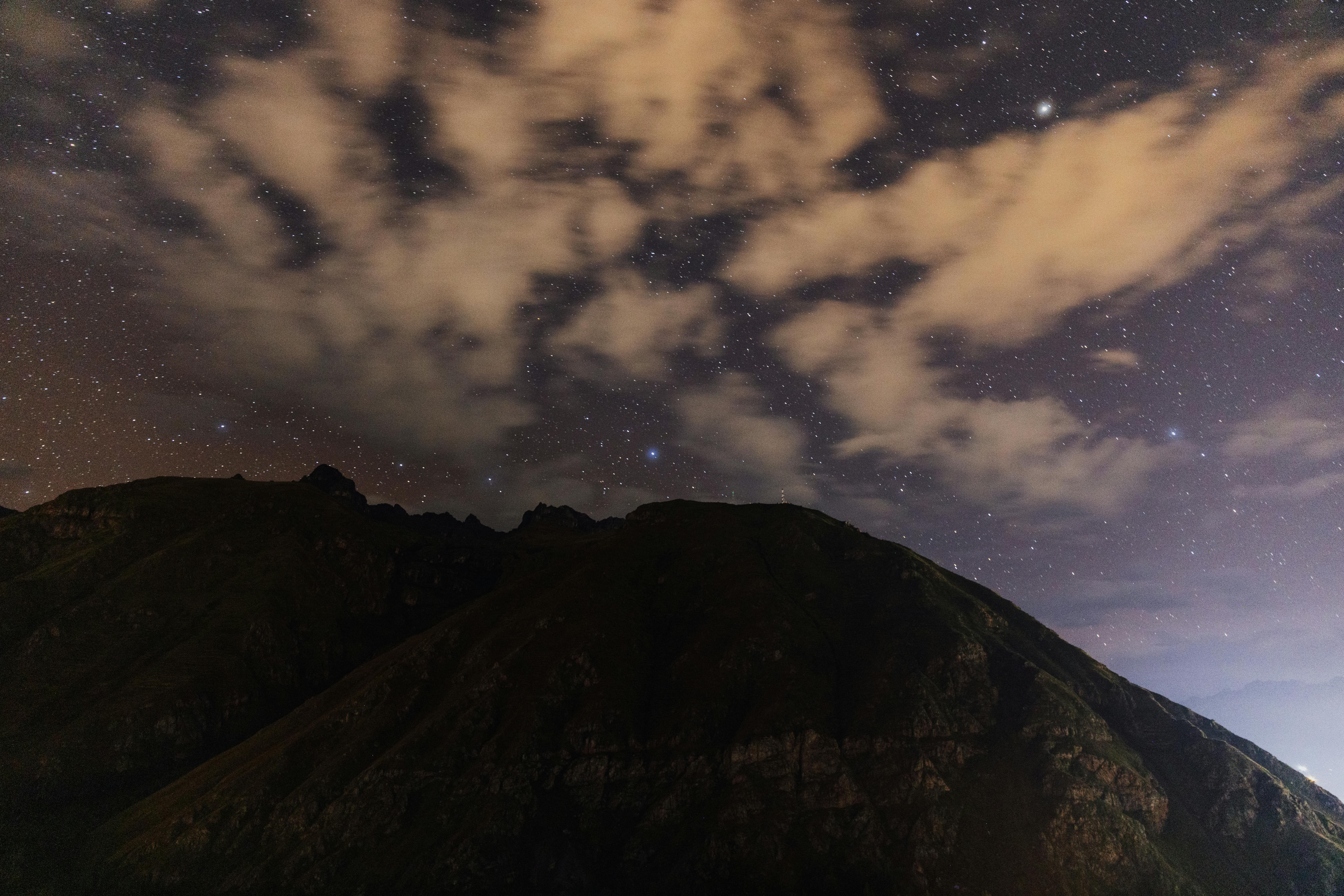 Stars and Cloud over Hill at Night · Free Stock Photo