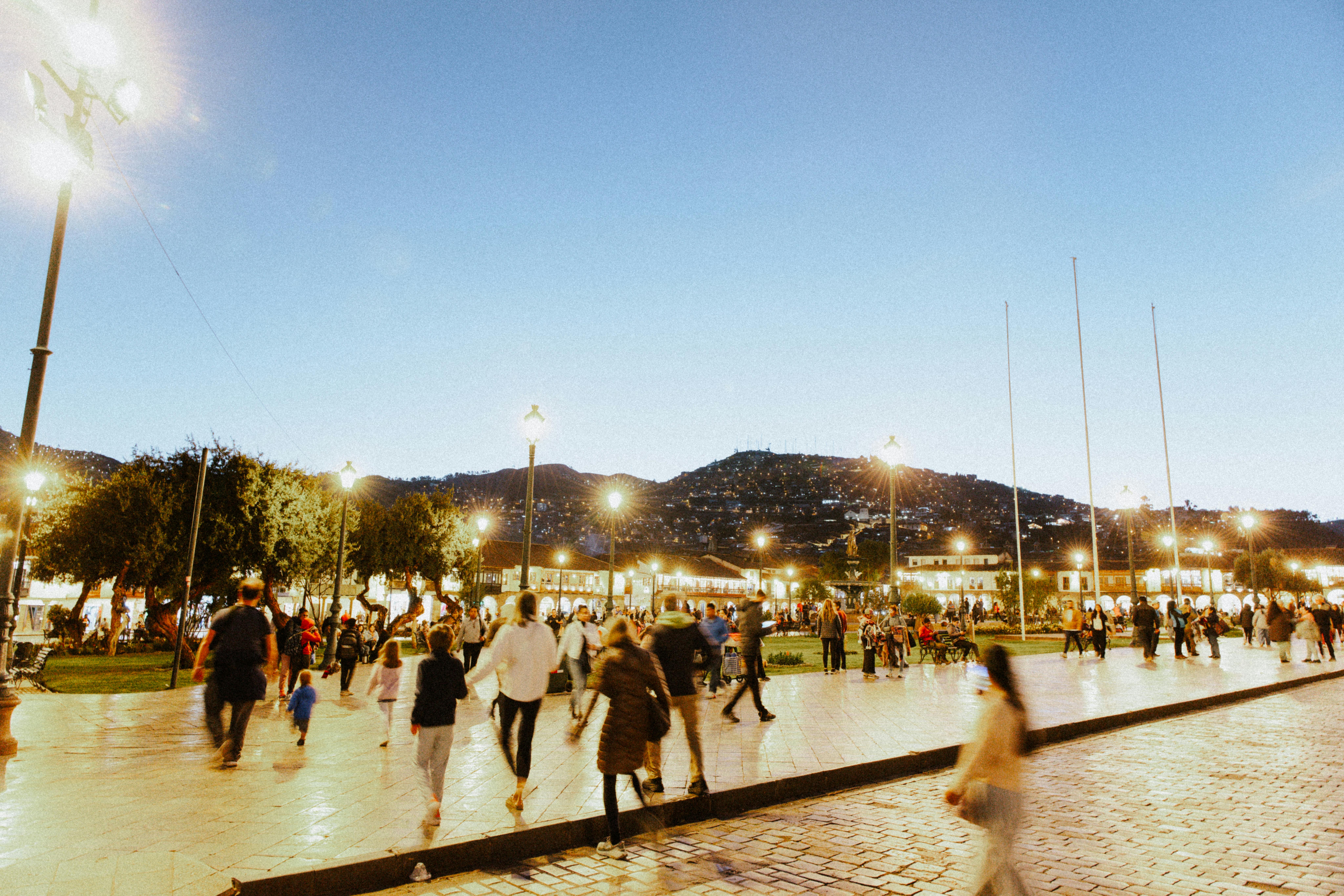 People walking in a plaza at night · Free Stock Photo
