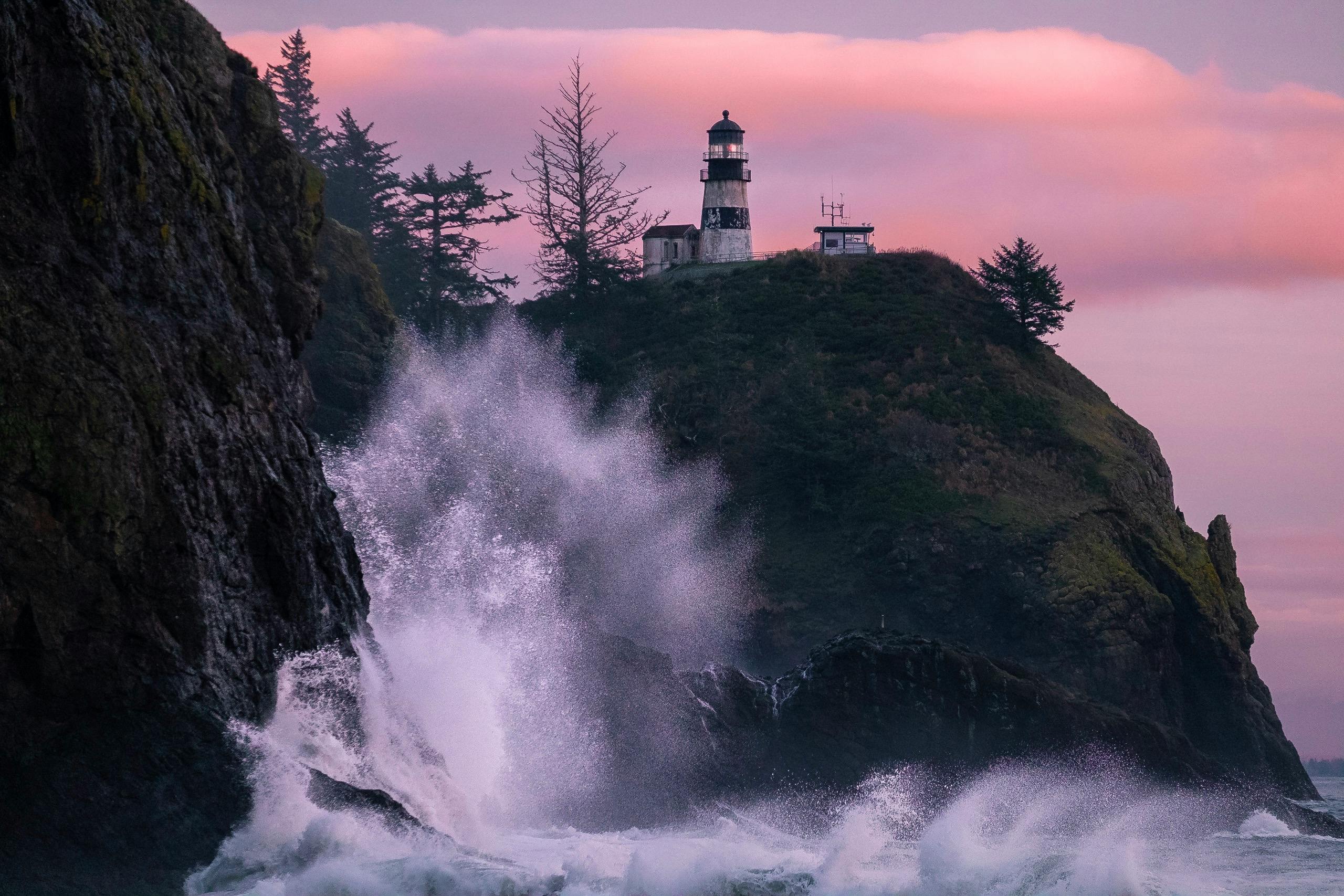 Photo of a Lighthouse Near Body of Water · Free Stock Photo