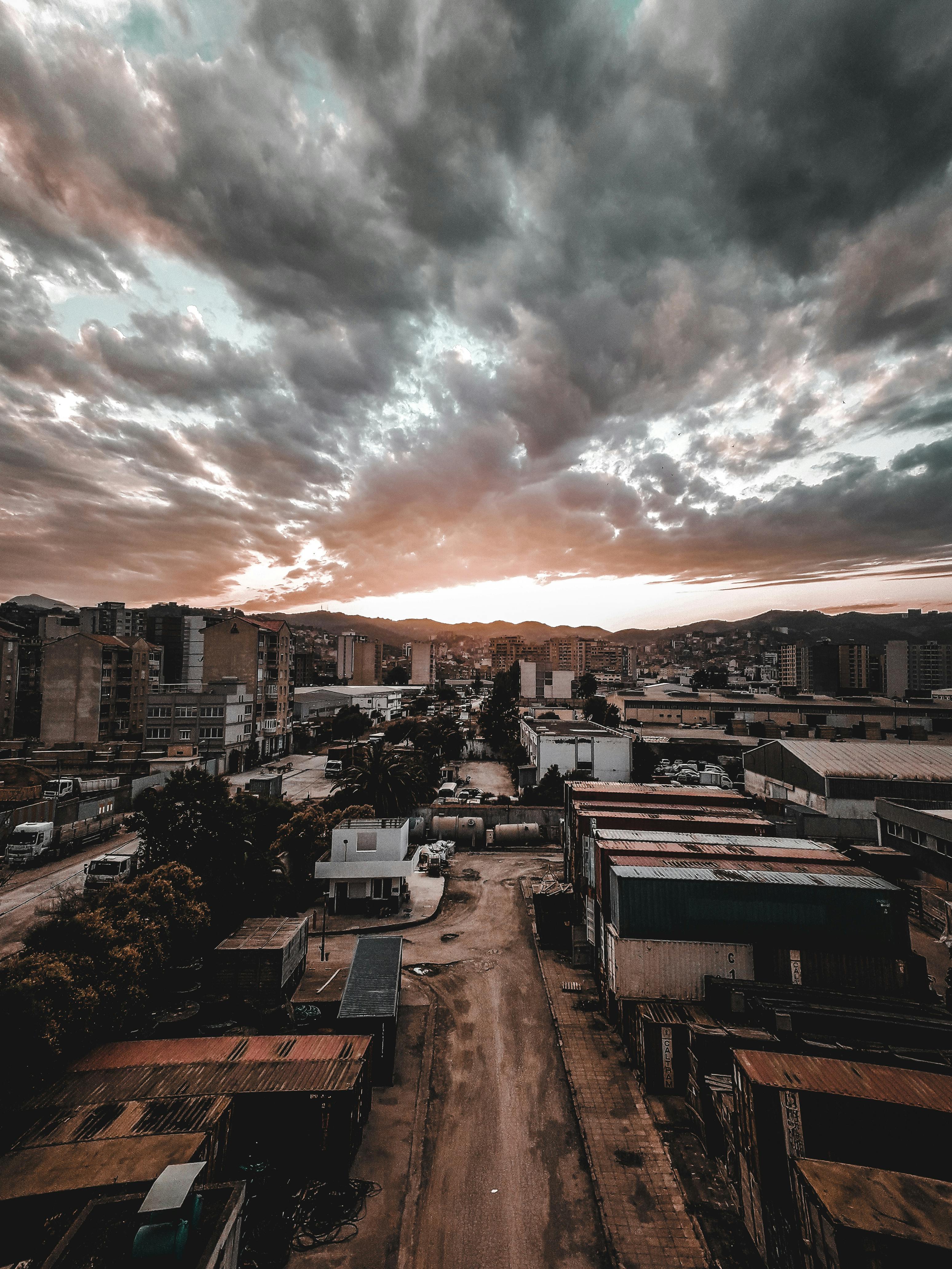 Aerial Photography If Cityscape Under Dramatic Sky · Free Stock Photo