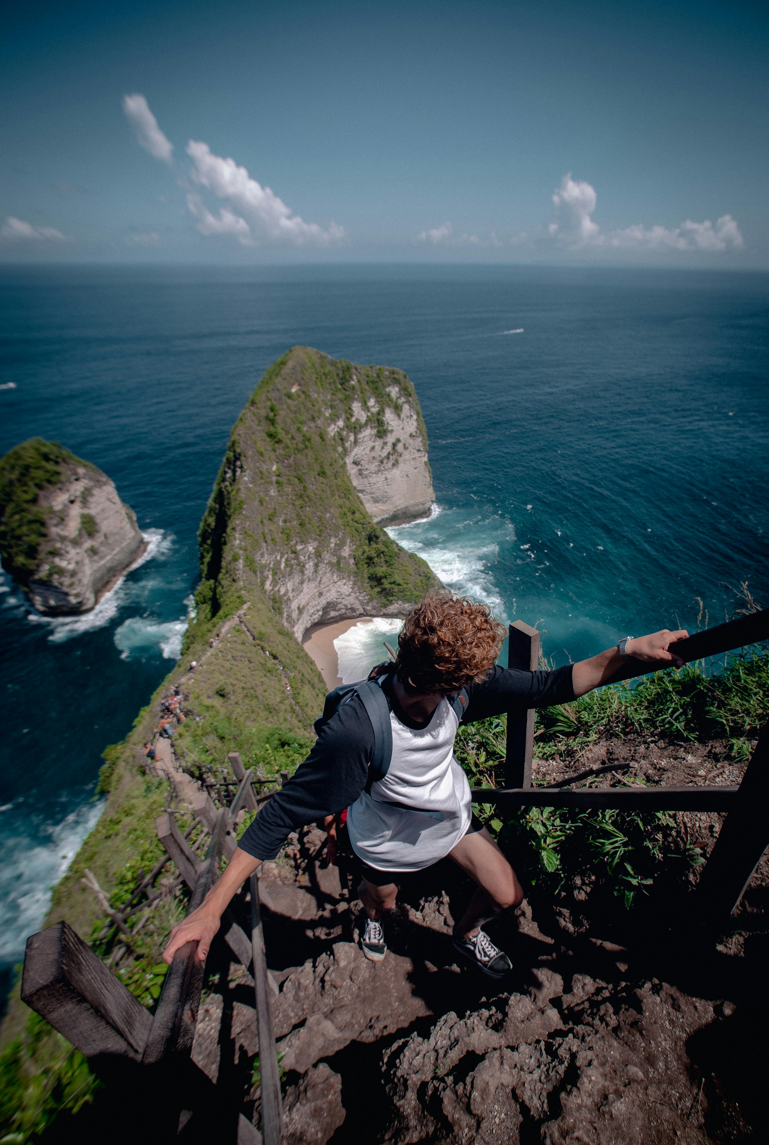 Person Climbing Up Rock Stairs · Free Stock Photo