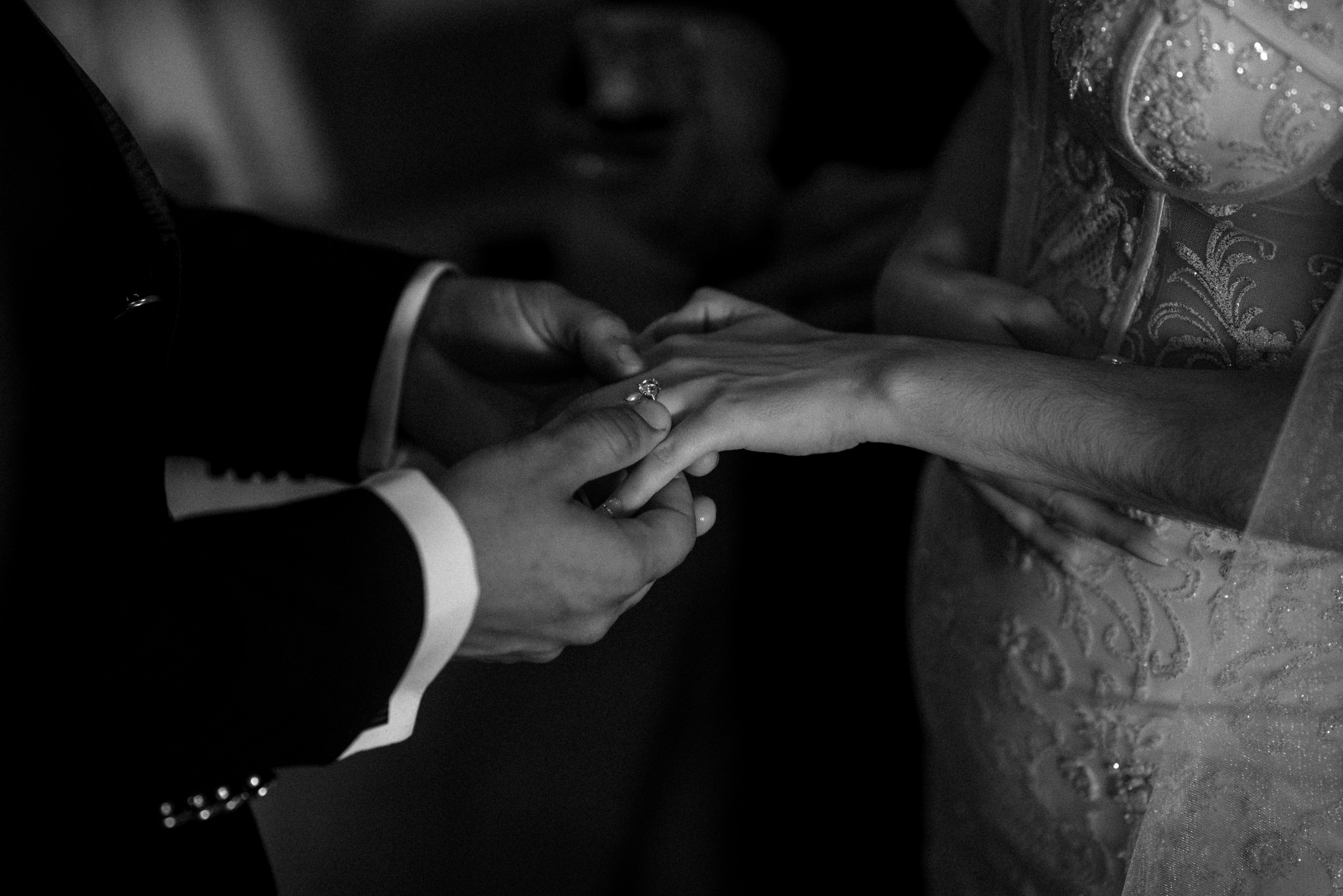 Groom Putting the Wedding Ring on the Bride Hand · Free Stock Photo
