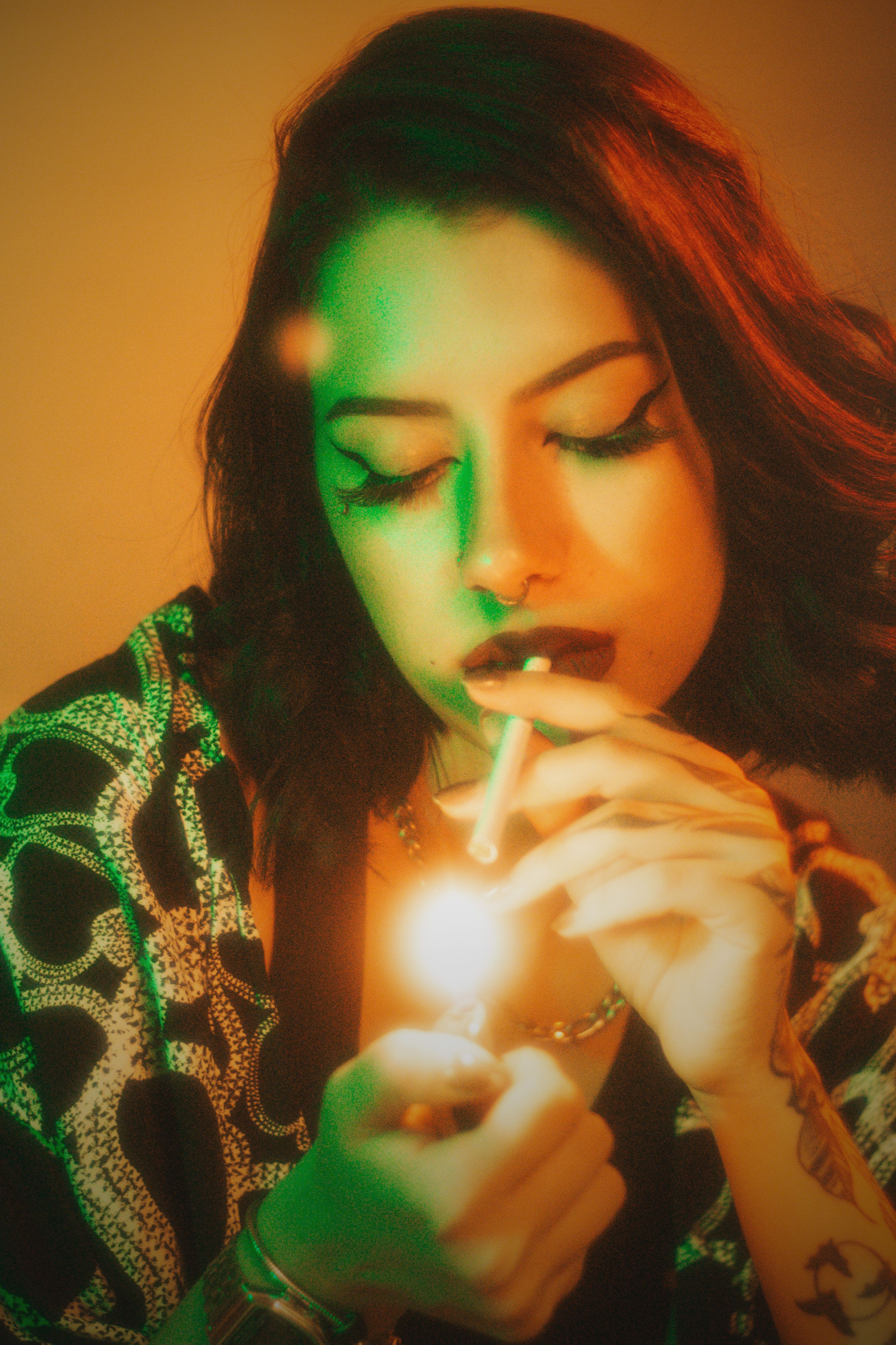 Photo of a Woman Lighting a Cigarette · Free Stock Photo