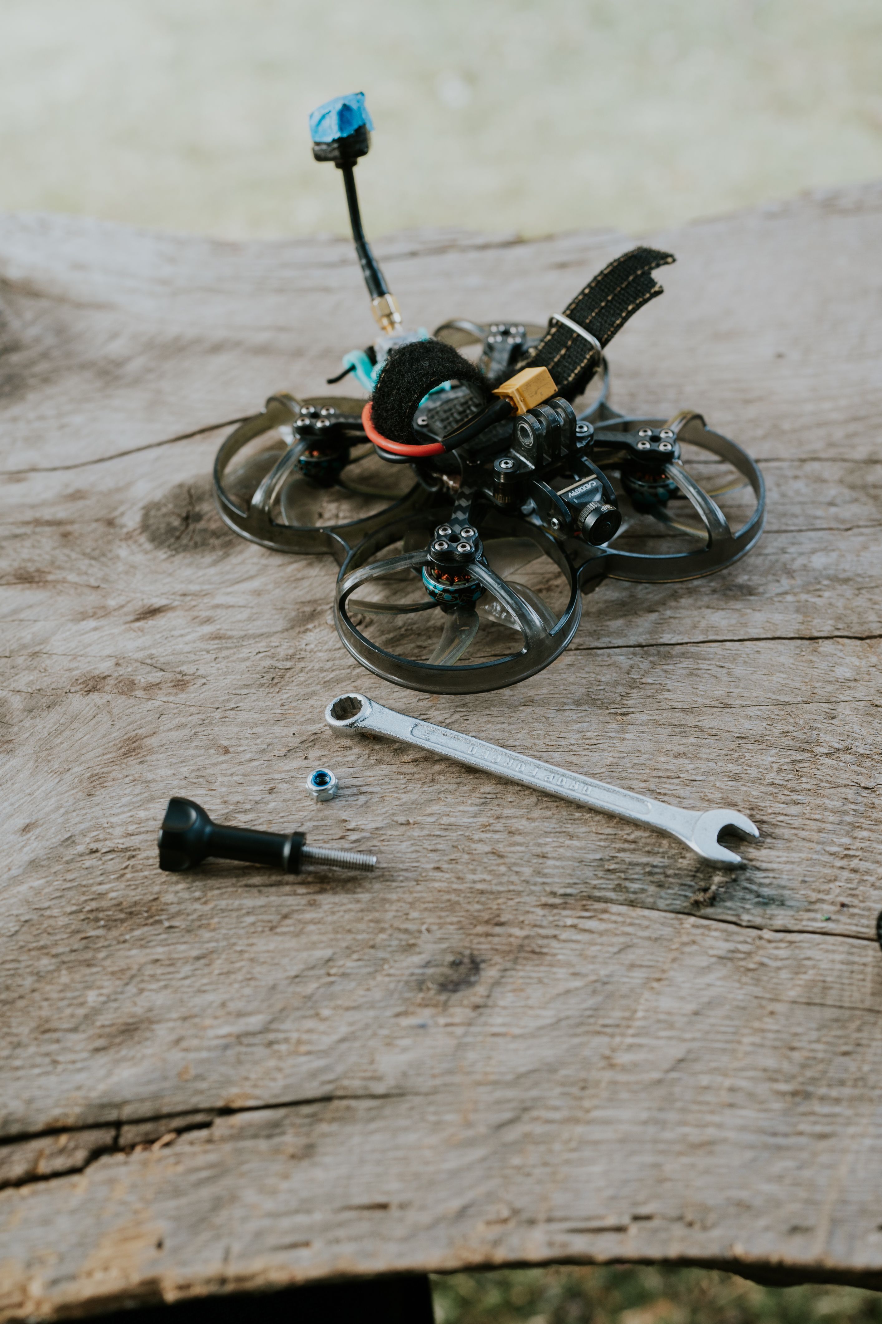 Parts of a Small Toy Robot on a Wooden Table · Free Stock Photo