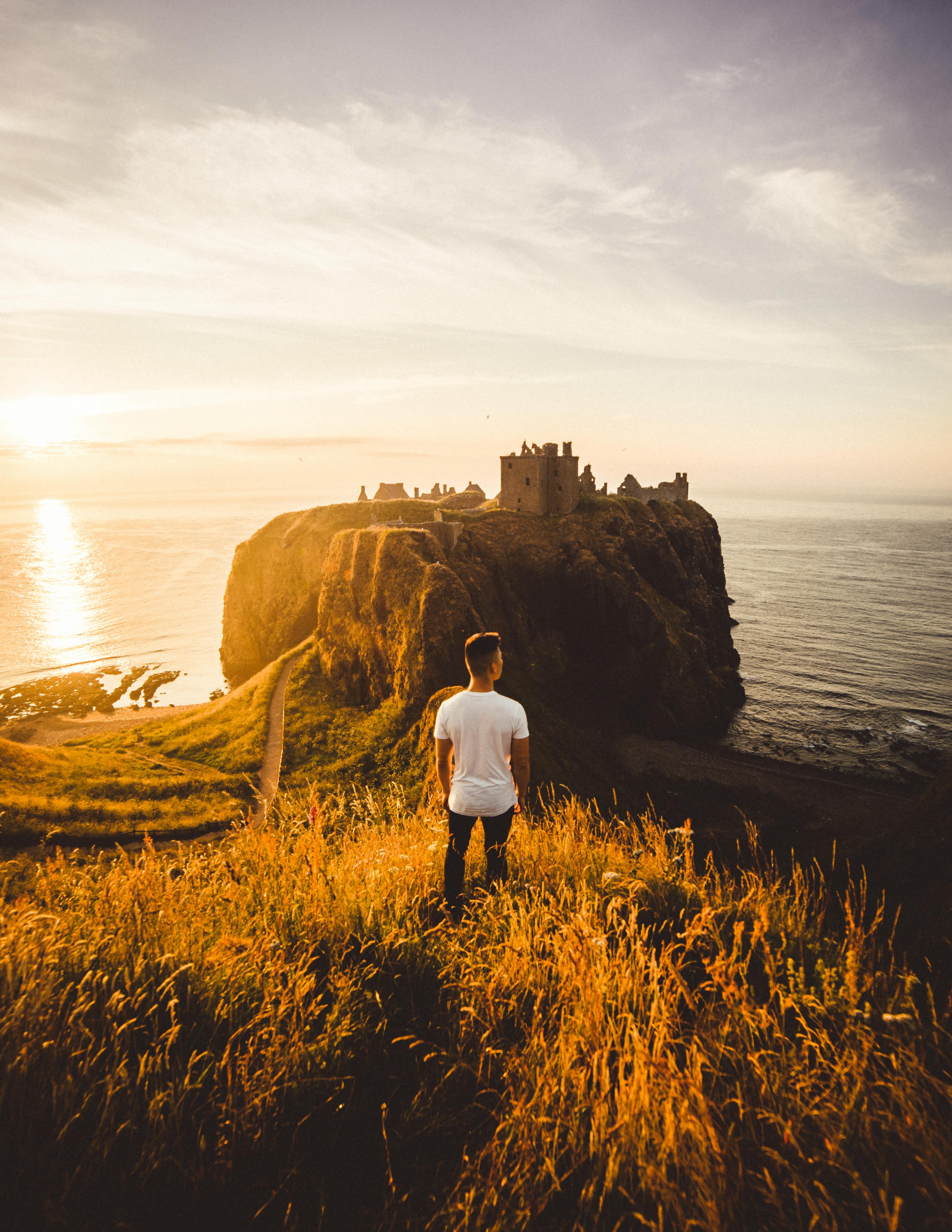 Man Standing on Grass Field · Free Stock Photo