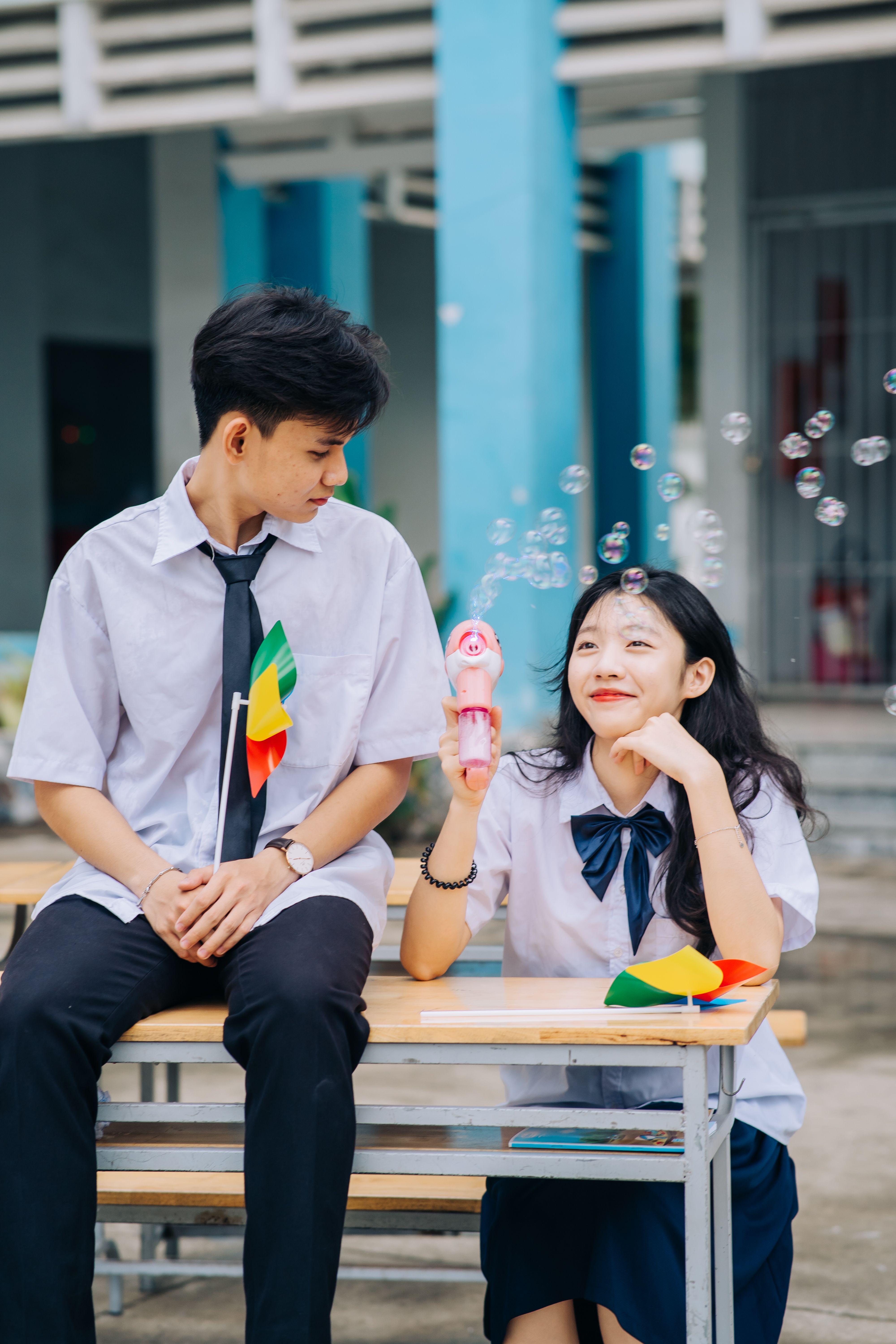 Smiling Students in School Uniforms Playing With Soap Bubbles and Toy ...