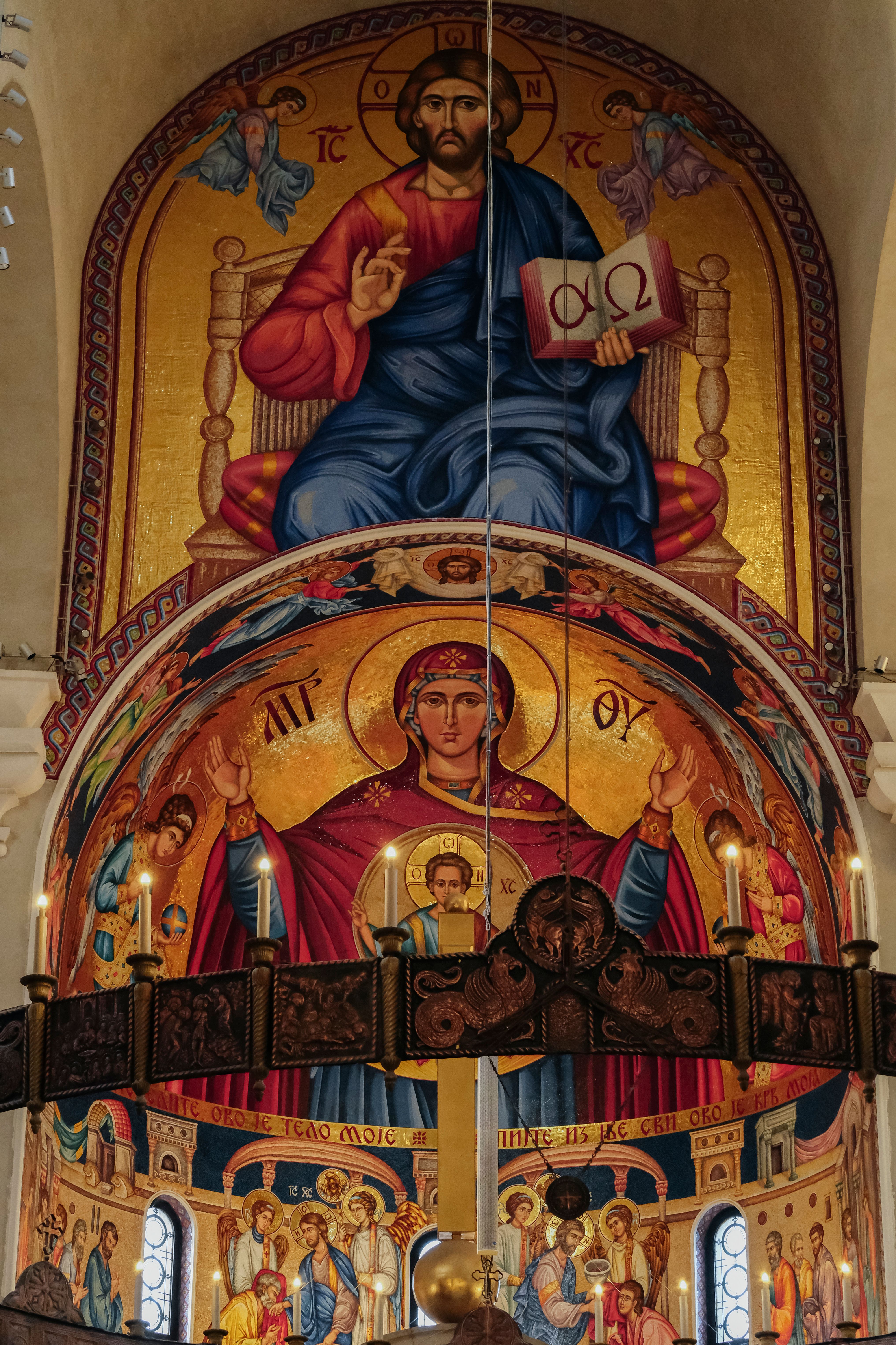 The interior of a church with a large painting of jesus · Free Stock Photo