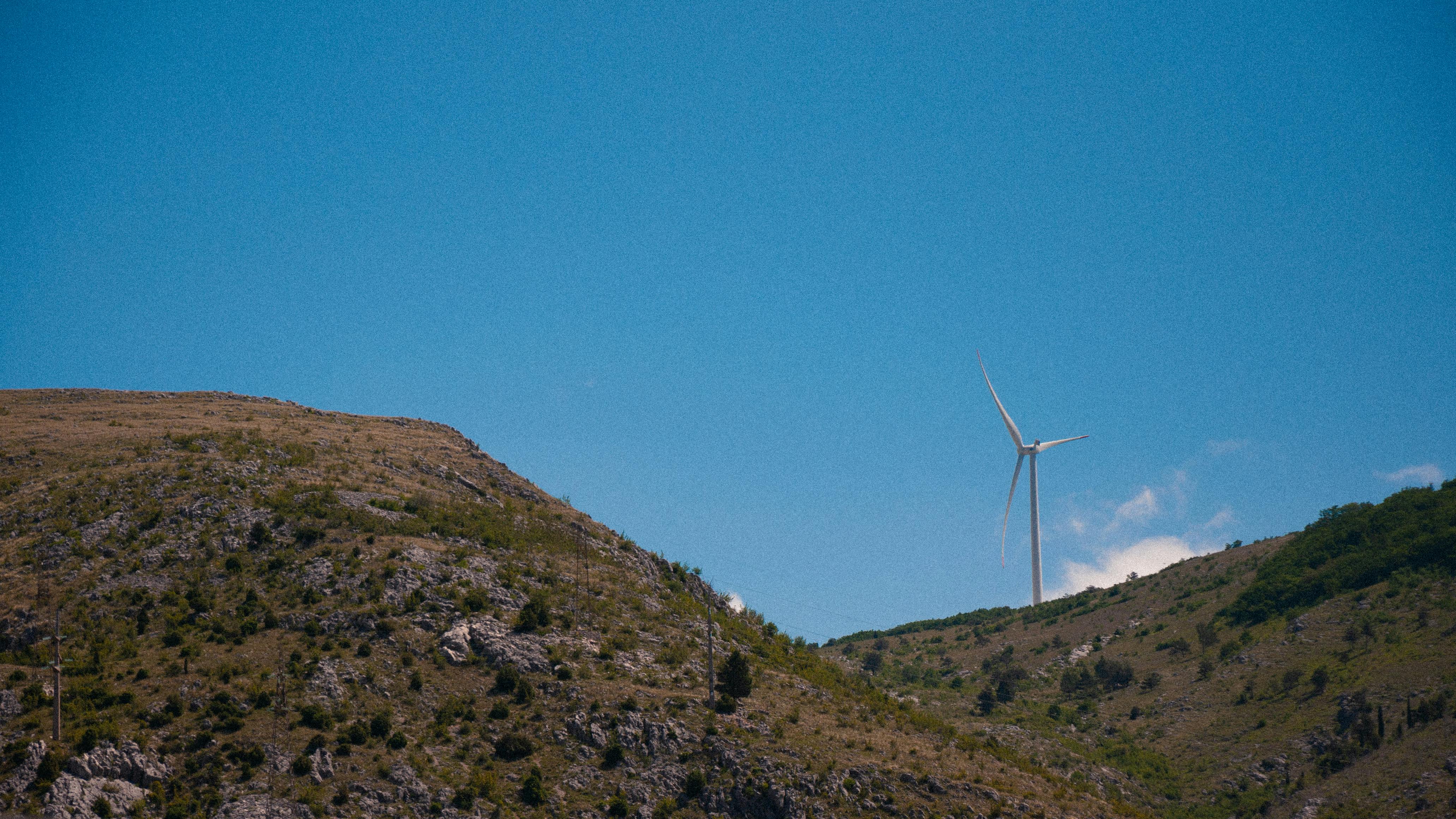 A Wind Turbine Over the Hill · Free Stock Photo