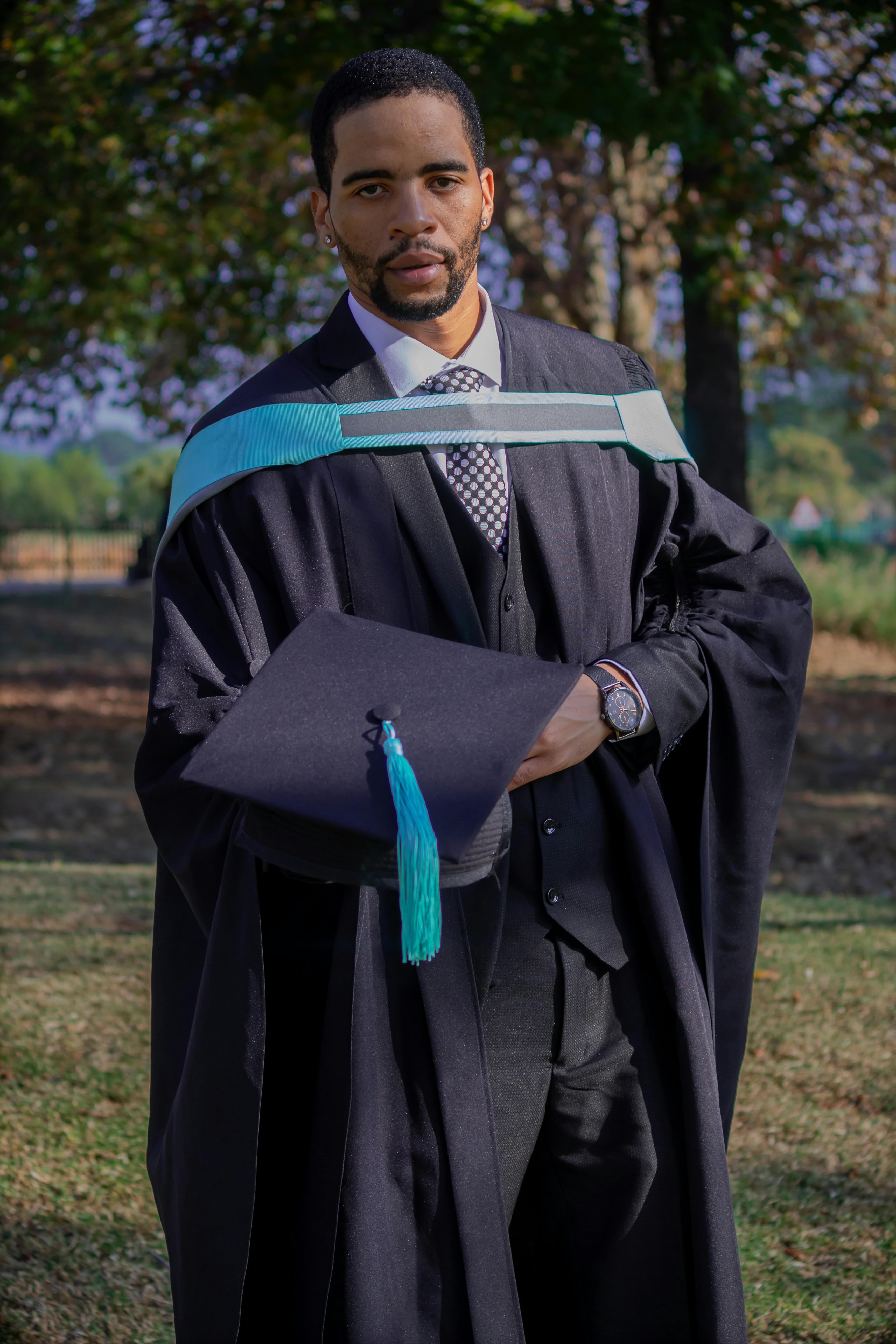 Man in Black Suit and Gown for Graduation · Free Stock Photo