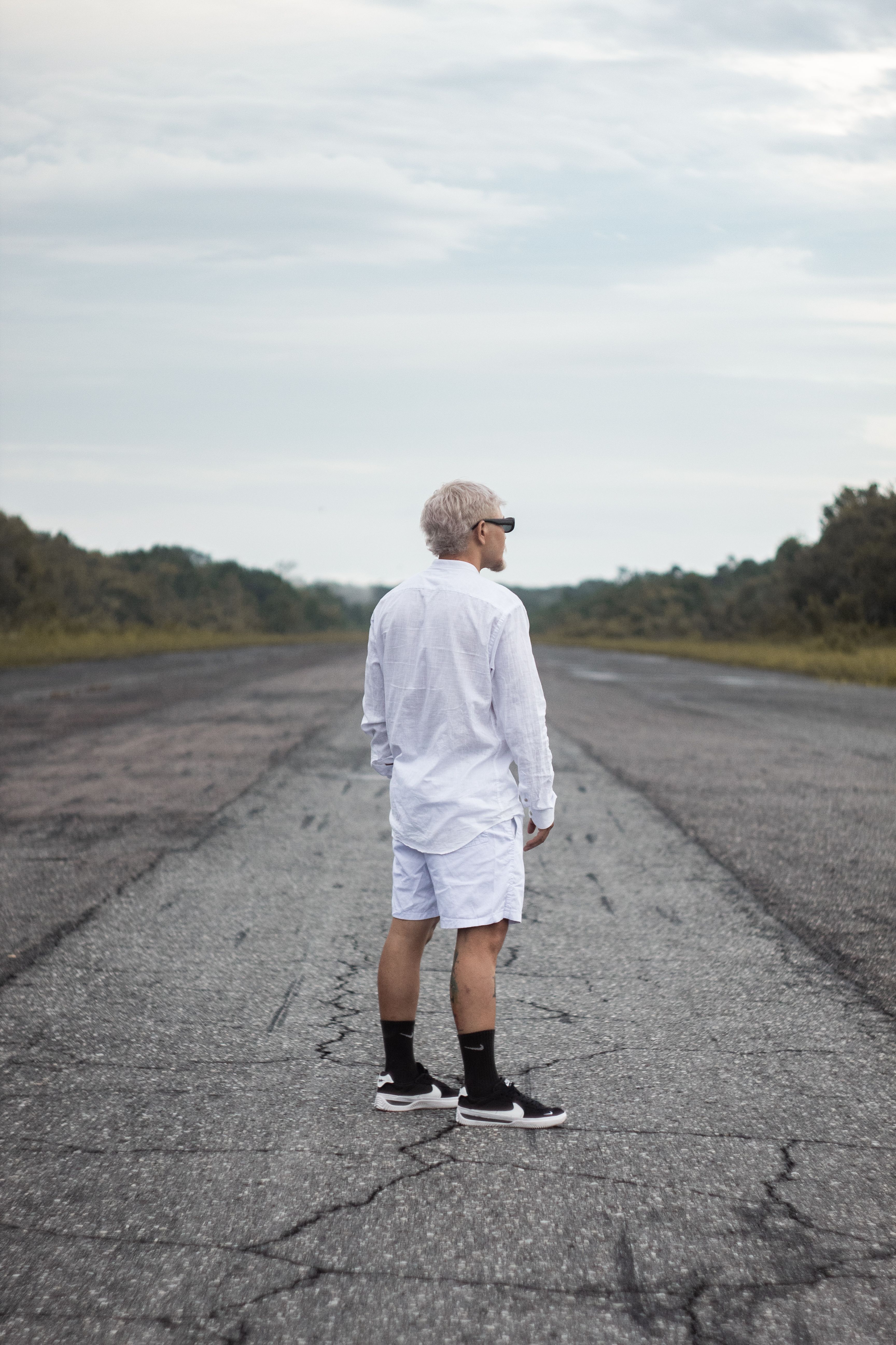Man in White Clothes on Road · Free Stock Photo