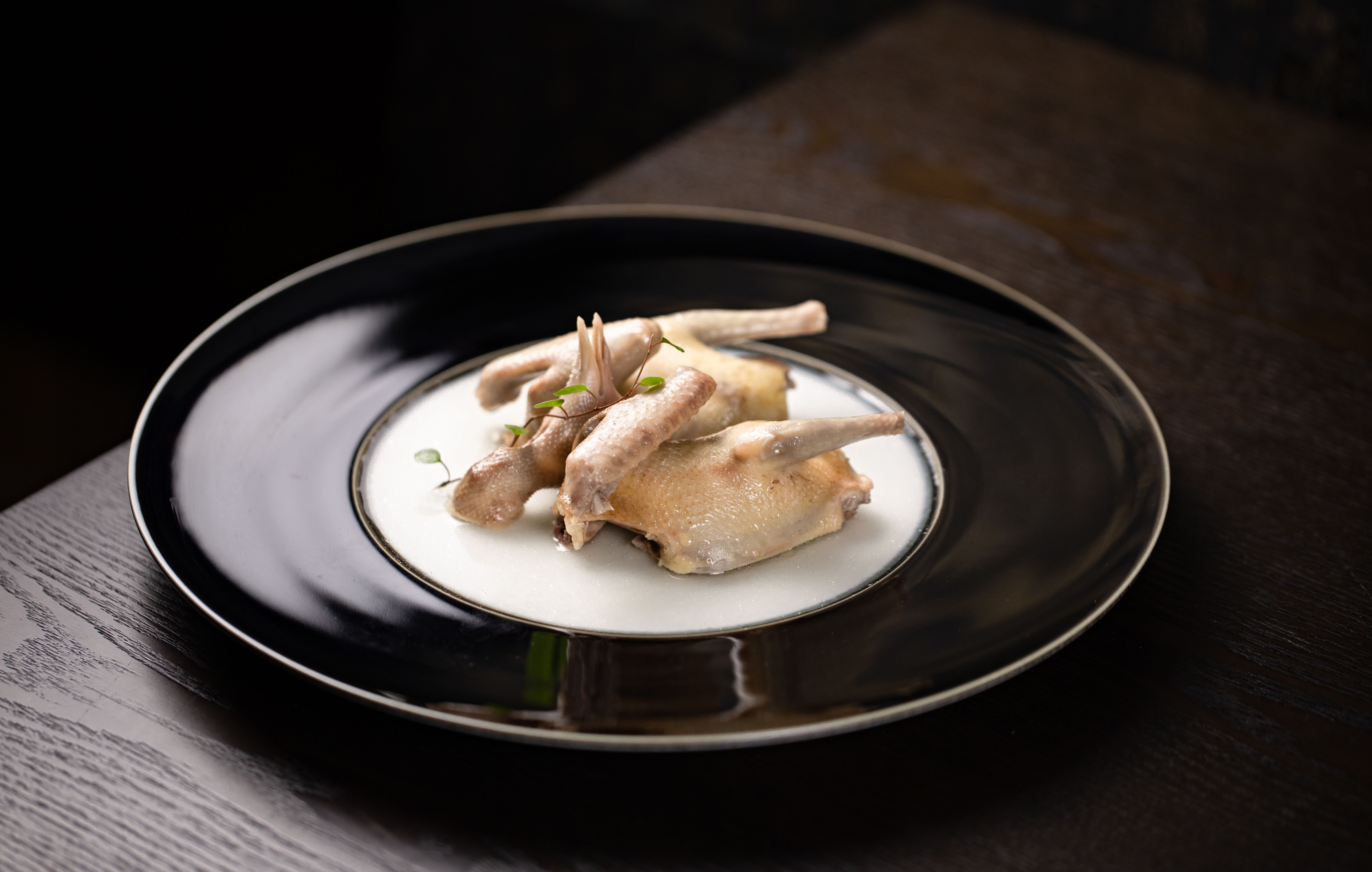 A Quail Meat on a Black And White Plate · Free Stock Photo