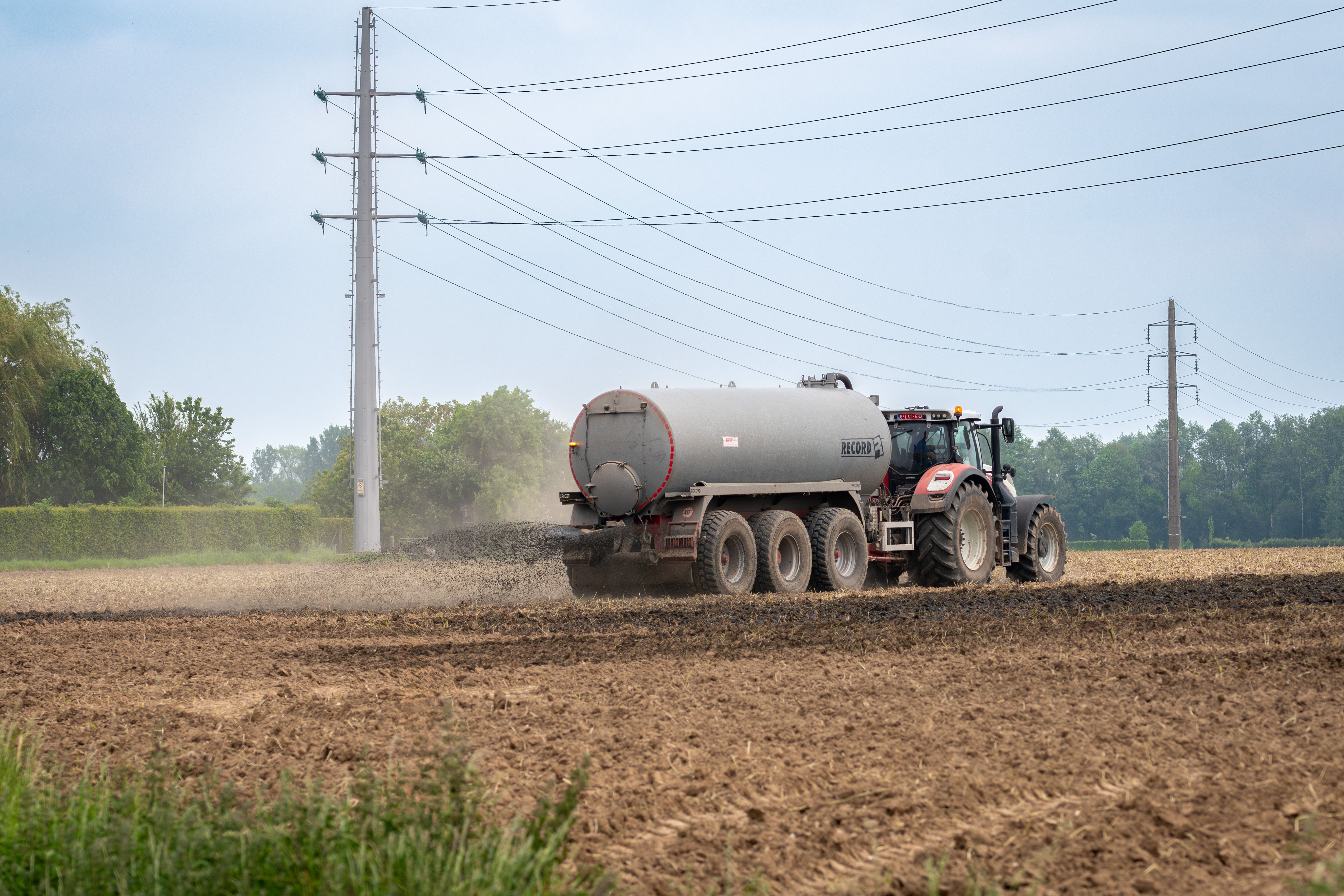 Tractor Hauling a Liquid Manure Cistern · Free Stock Photo