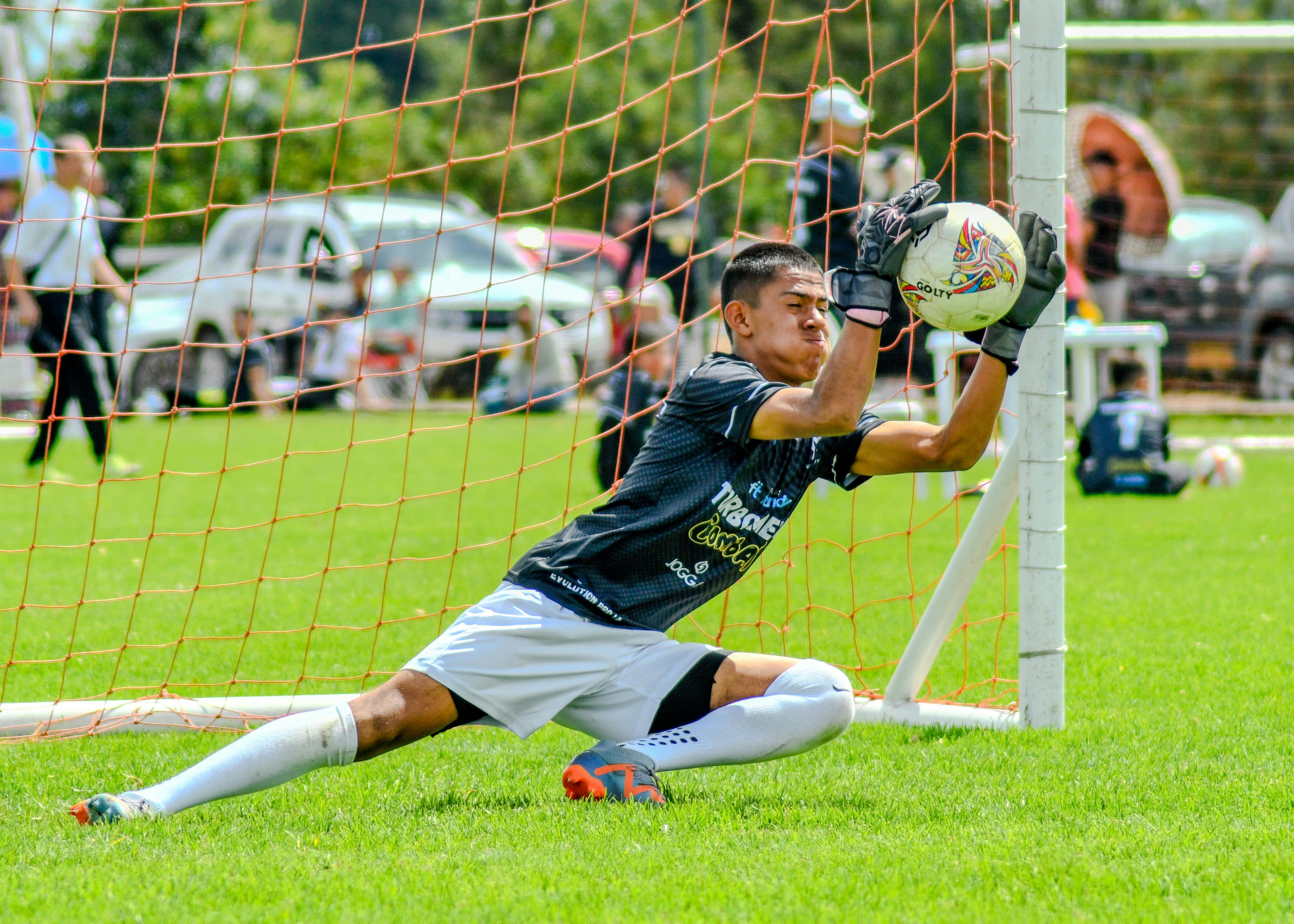 Goalkeeper Catching the Ball · Free Stock Photo