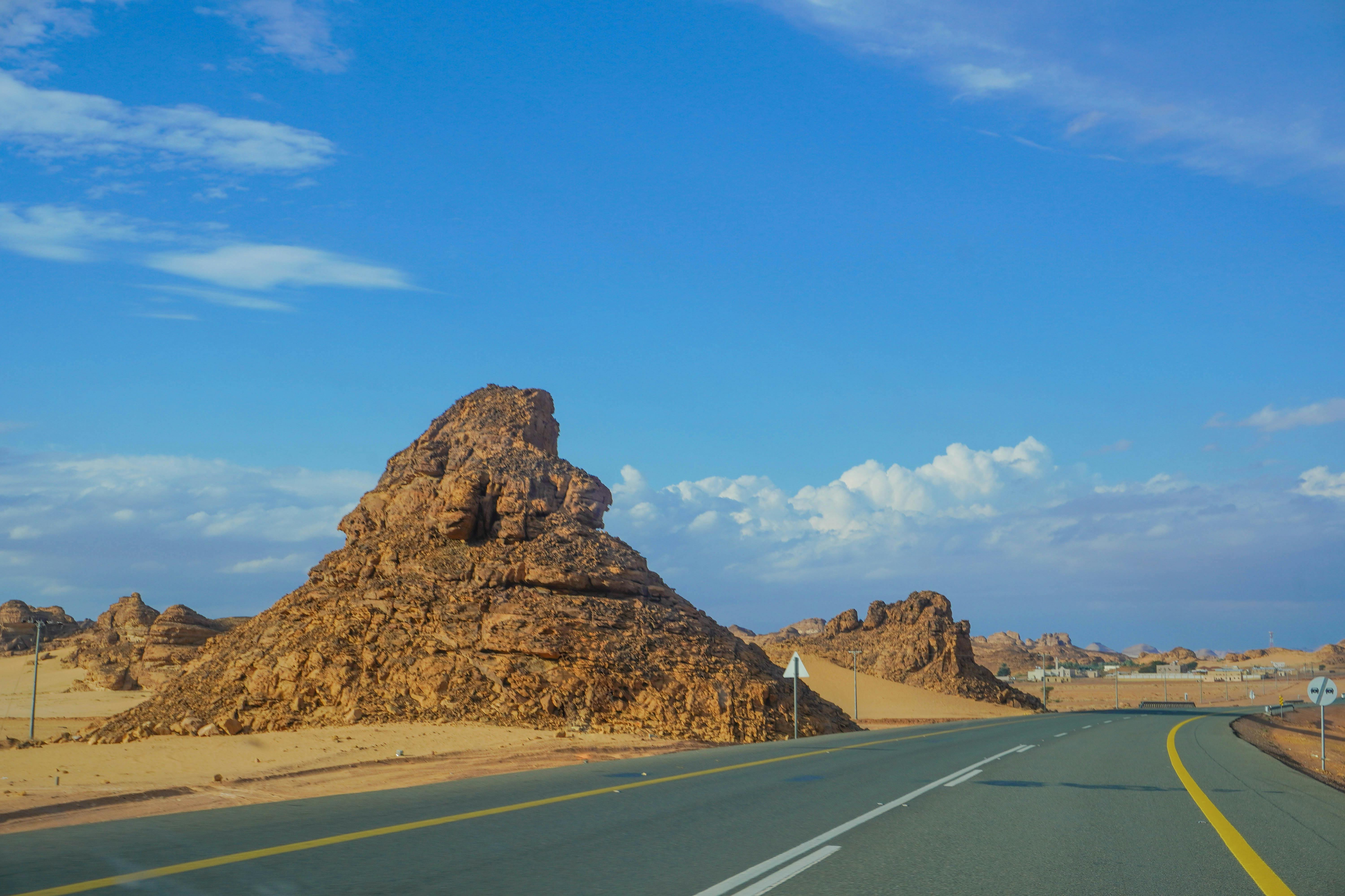 Desert Rock Formations along an Asphalt Highway · Free Stock Photo
