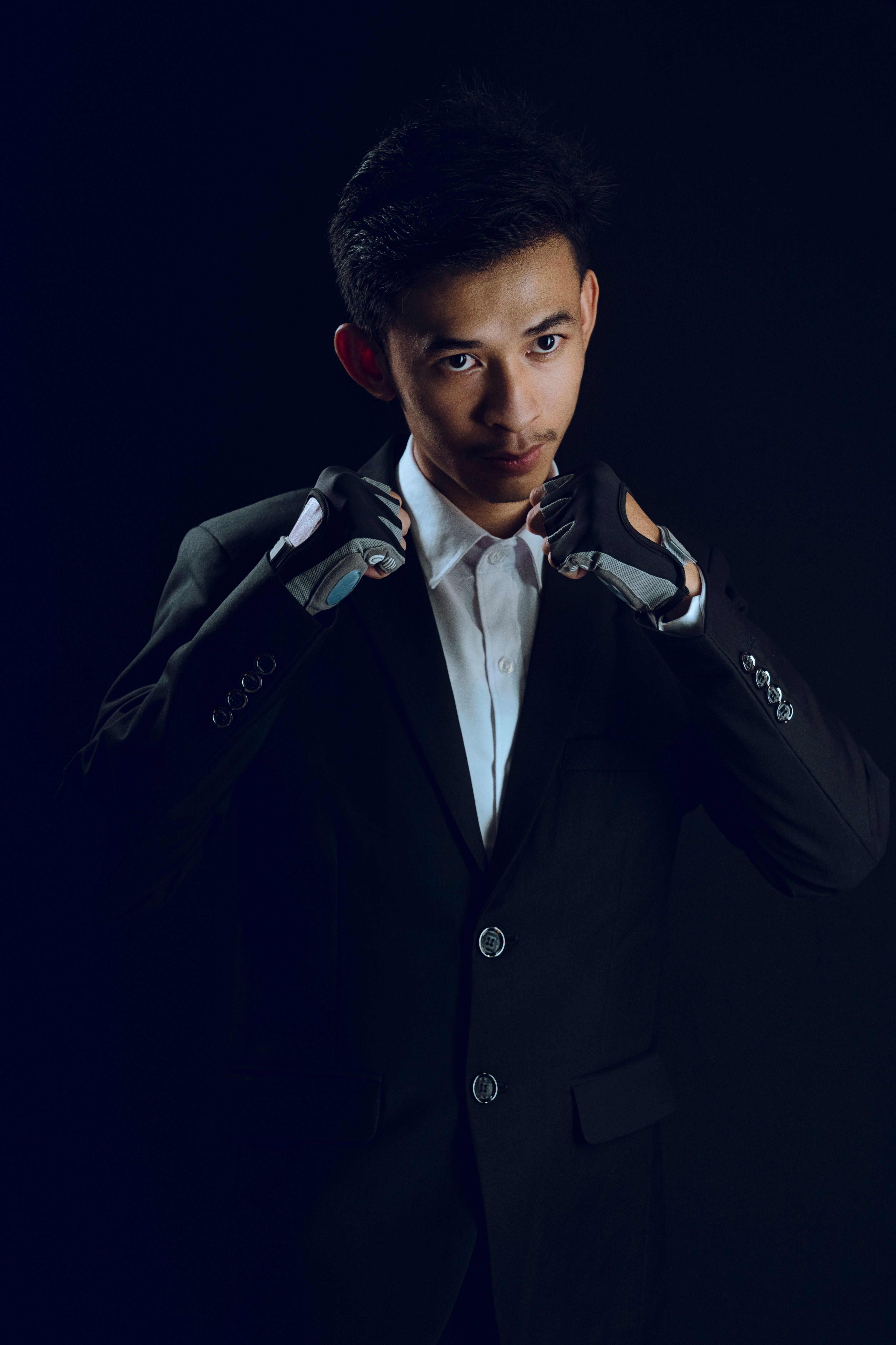 Man in Black Suit and Gloves in Boxing Position · Free Stock Photo
