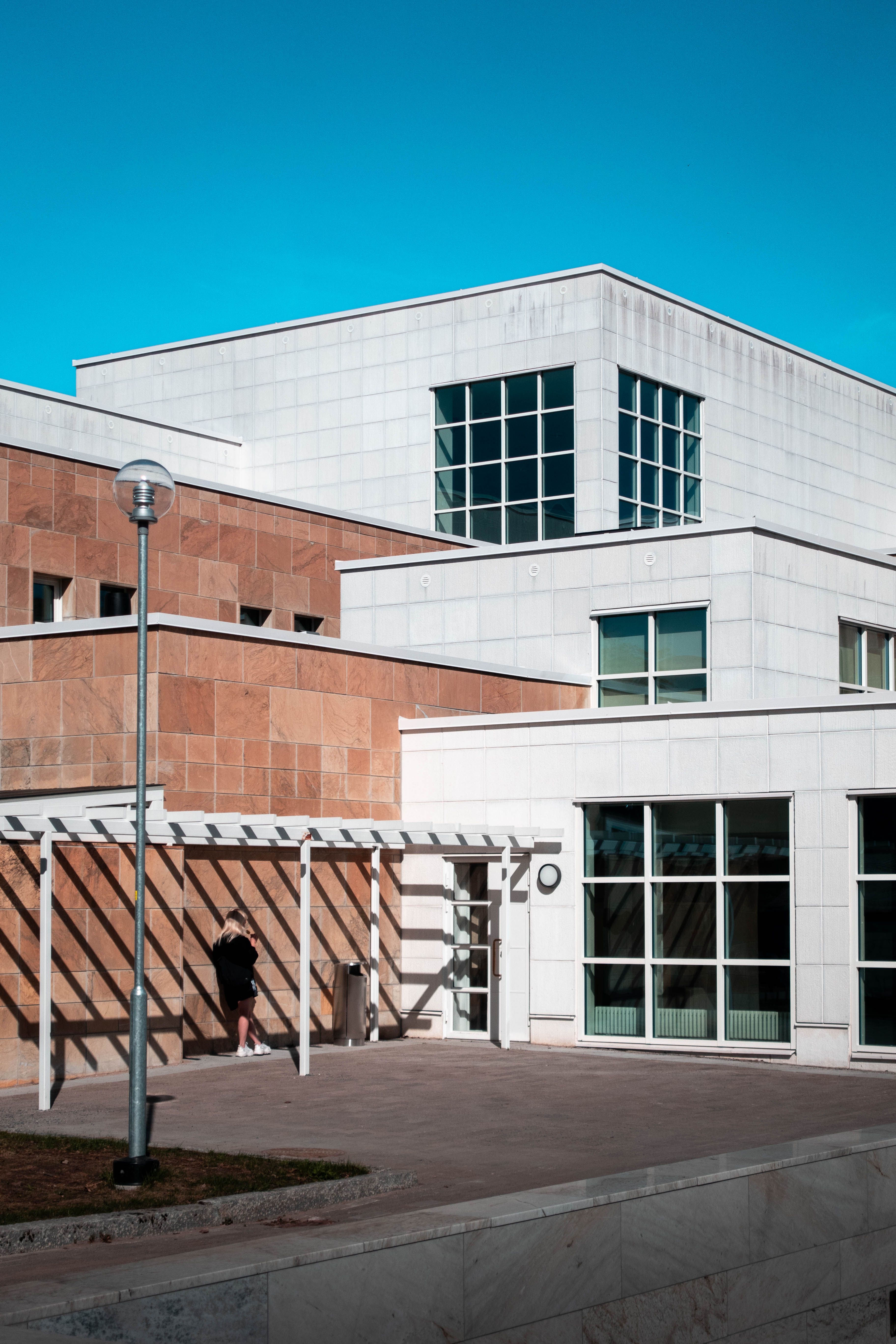 Glass Facade and Concrete Steps of a Modern Building · Free Stock Photo