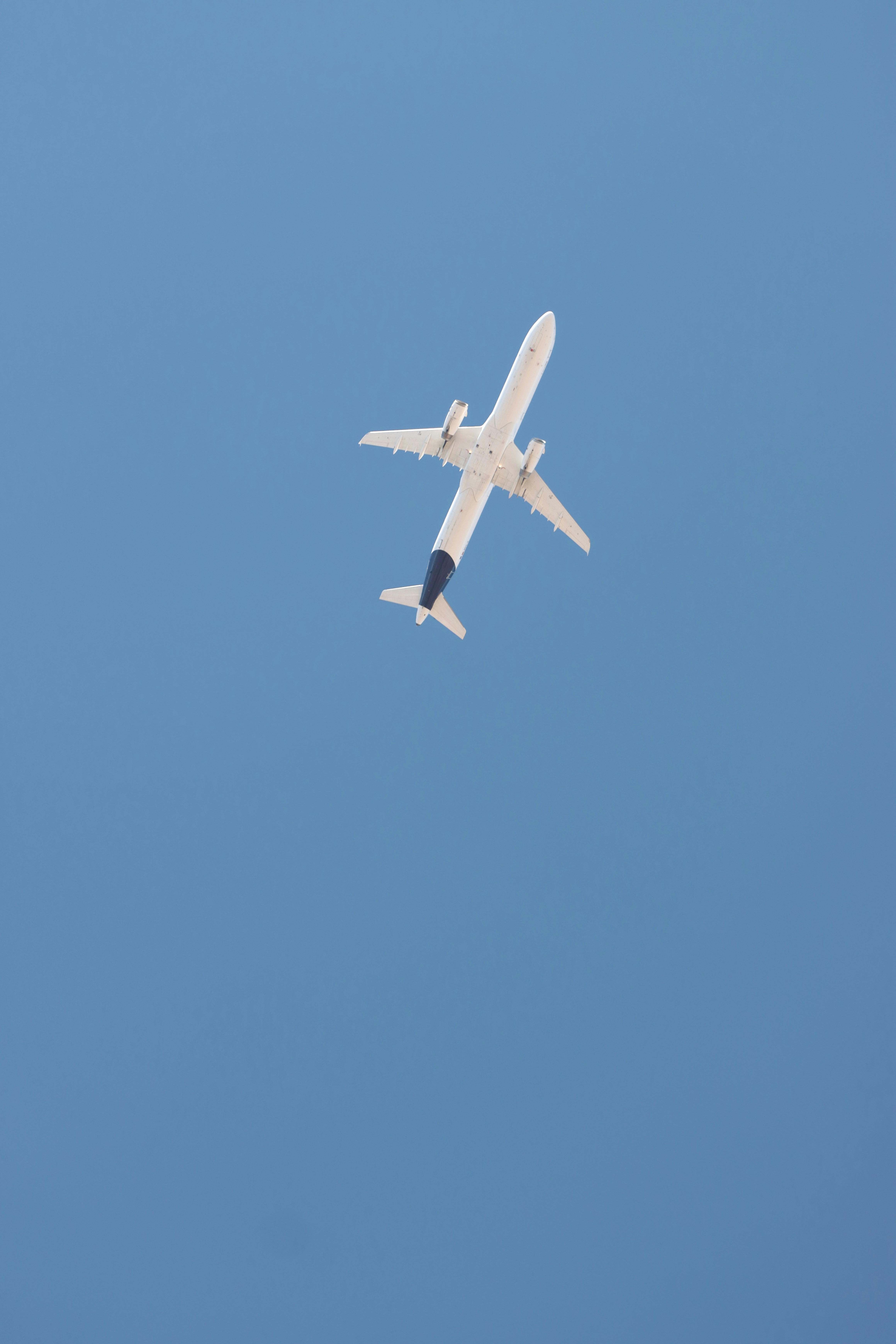 Low Angle Shot of Flying Airplane · Free Stock Photo