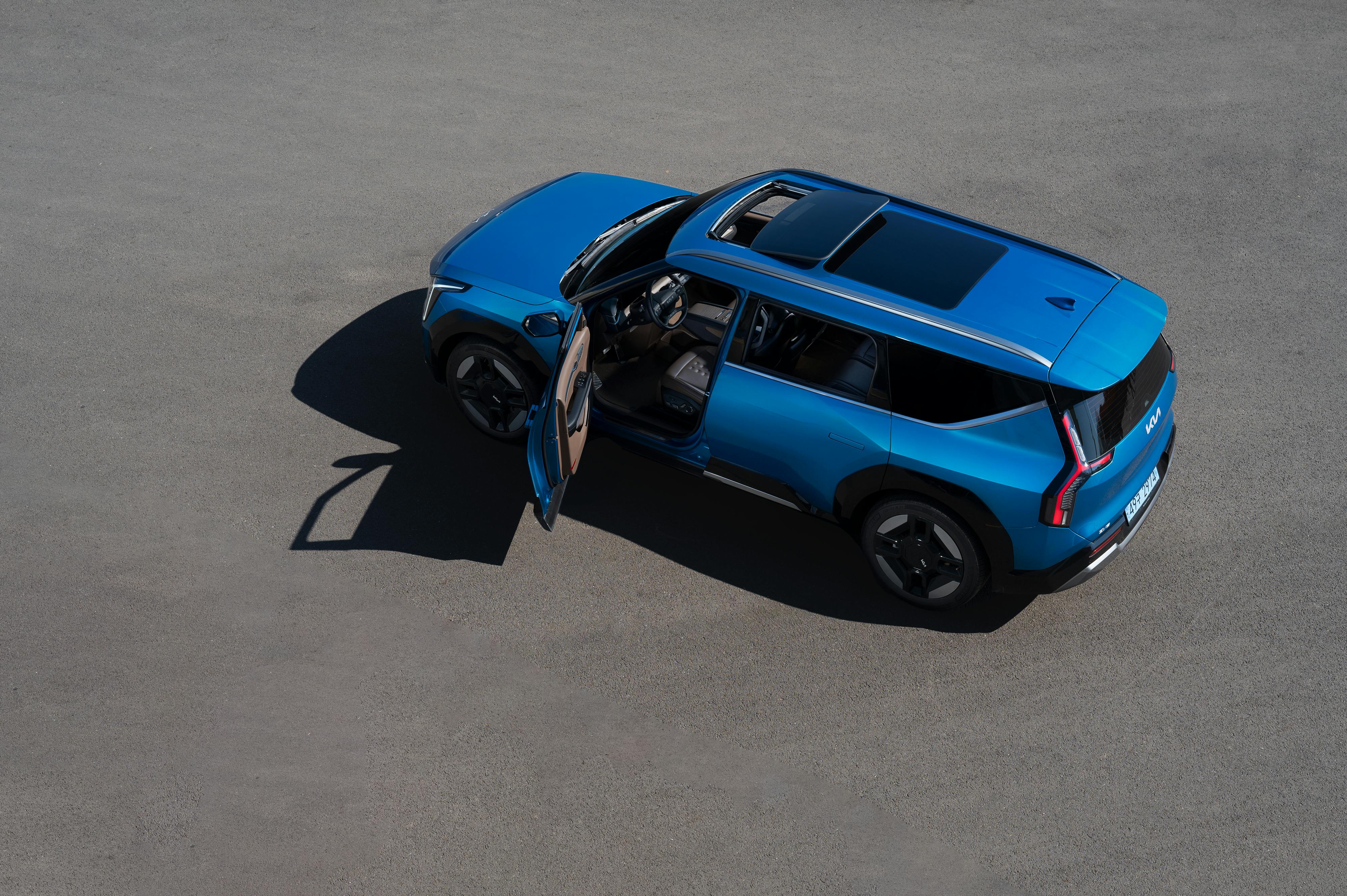 The left rear side of the Kia EV9 with the driver's door open. · Free ...