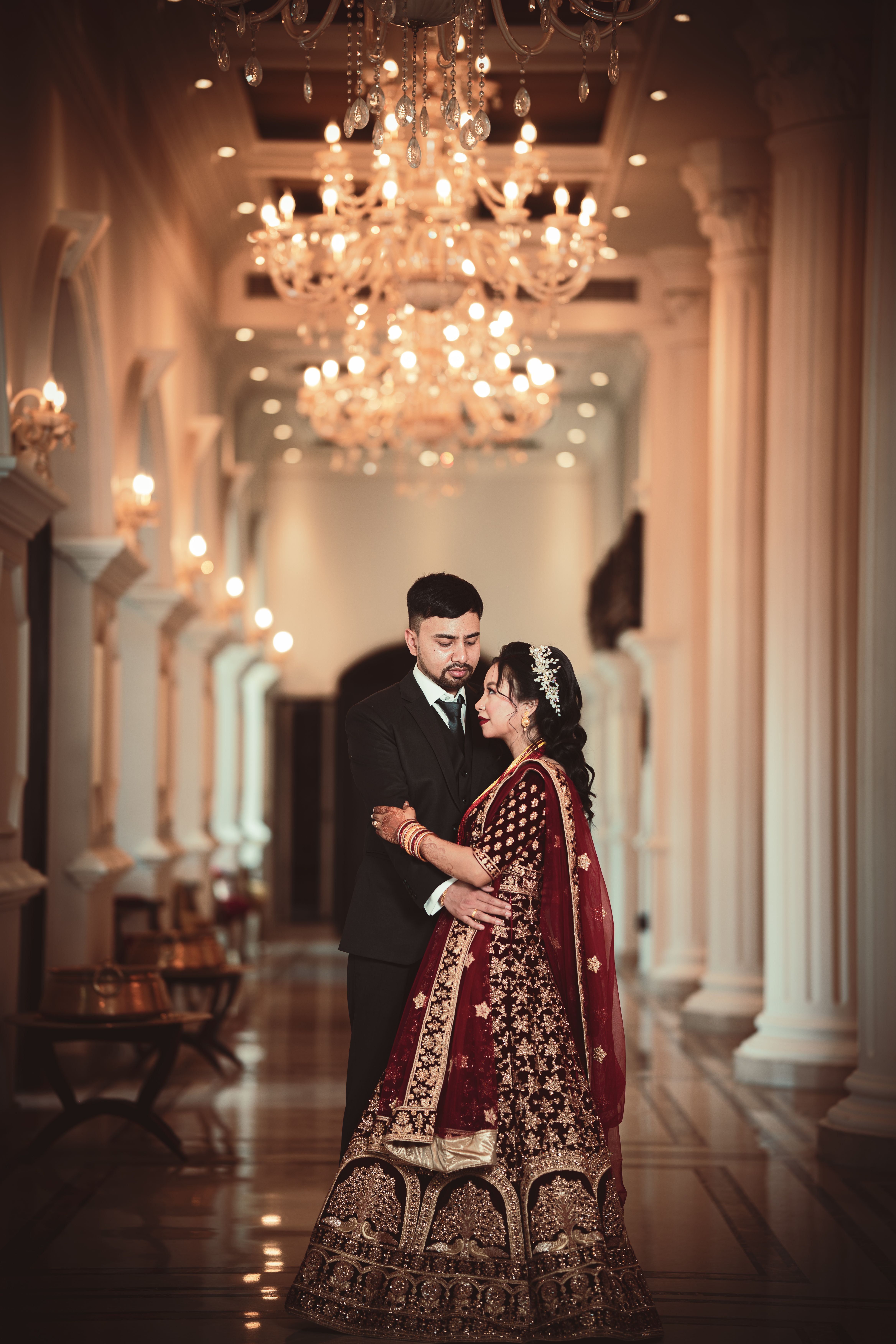 Elegant Groom in Suit and Bride in Red Dress Posing in Palace · Free ...