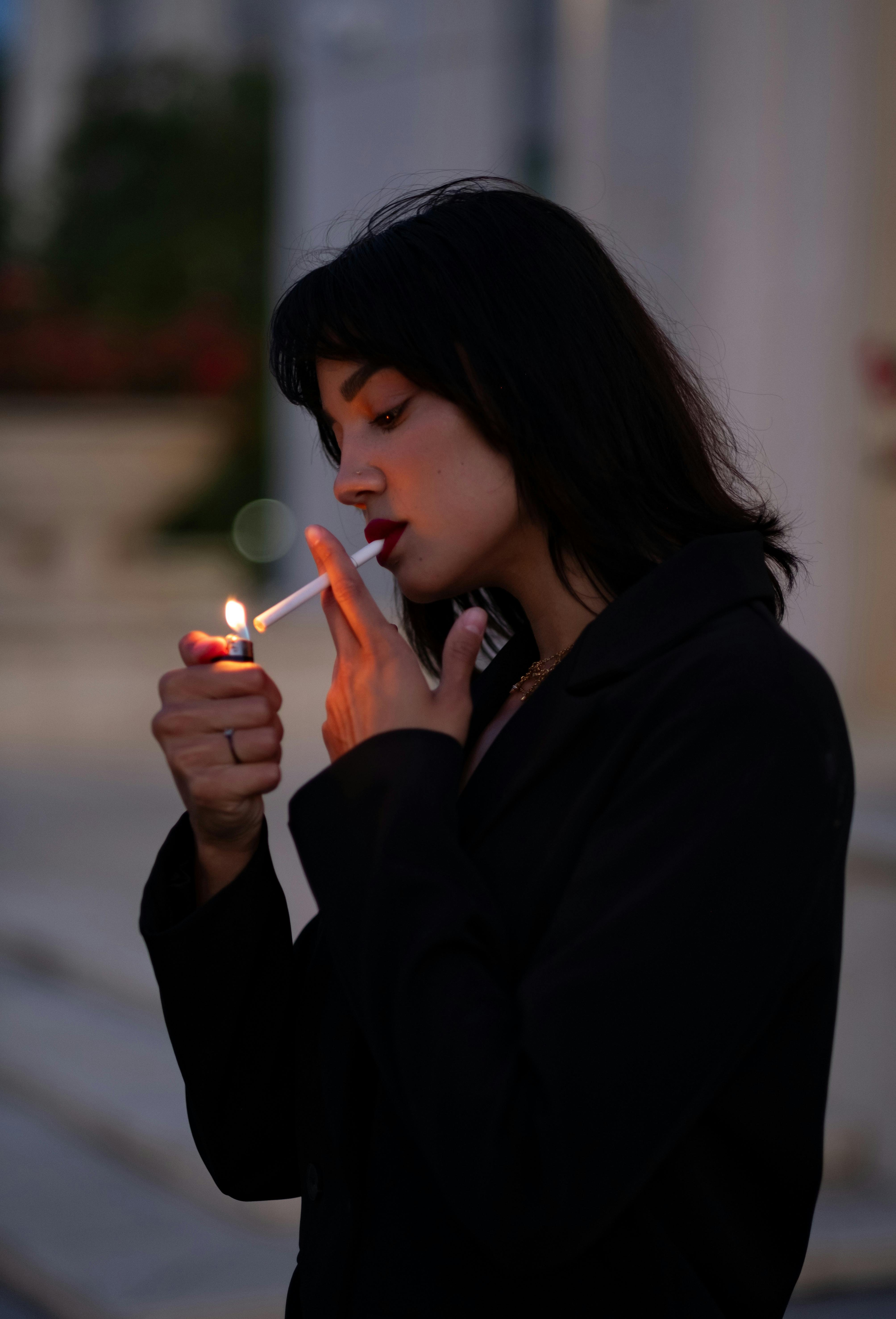 Beautiful Brunette Woman Lighting Cigarette · Free Stock Photo