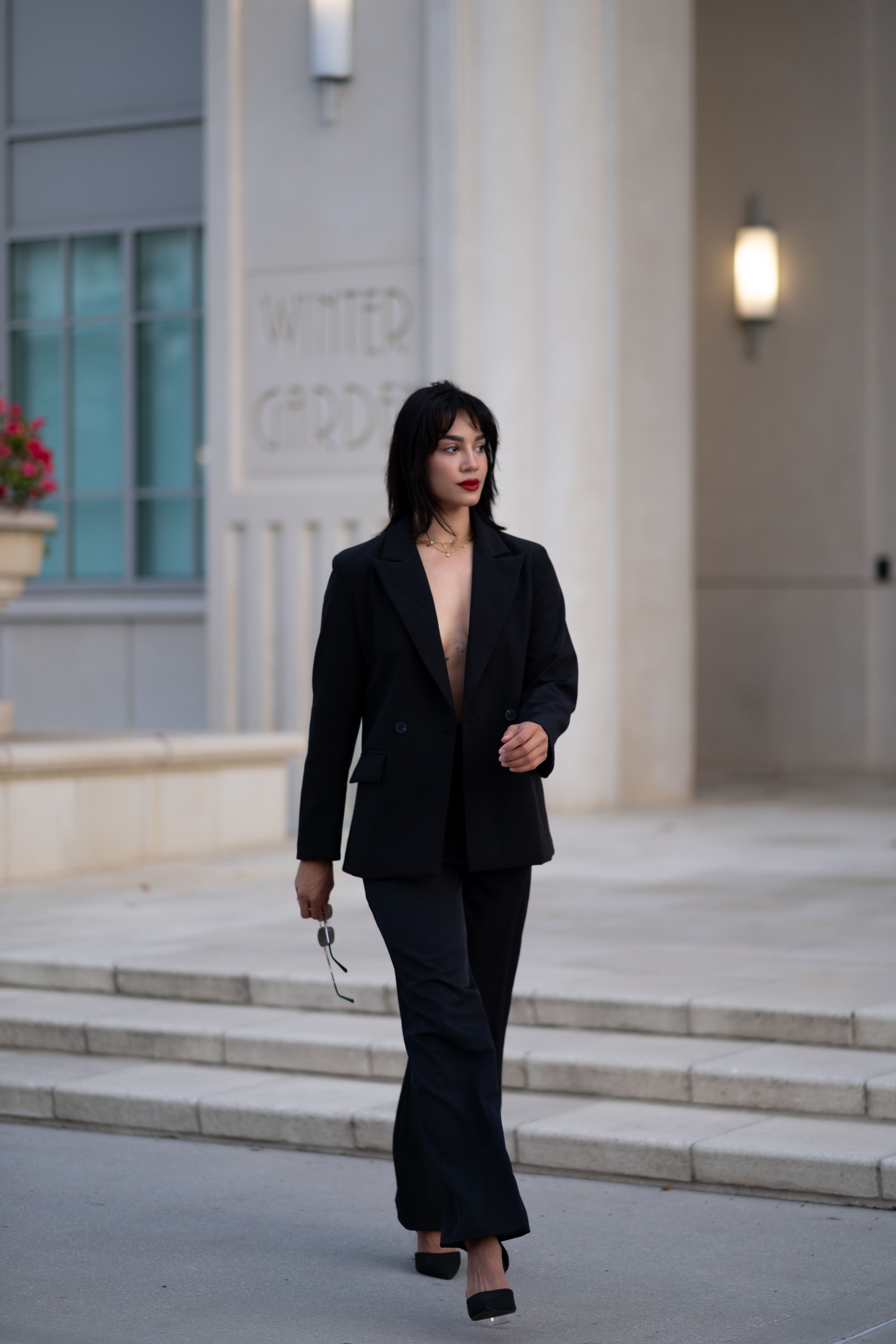 Glamour Woman in Black Jacket and High Heels Walking on Pavement · Free ...