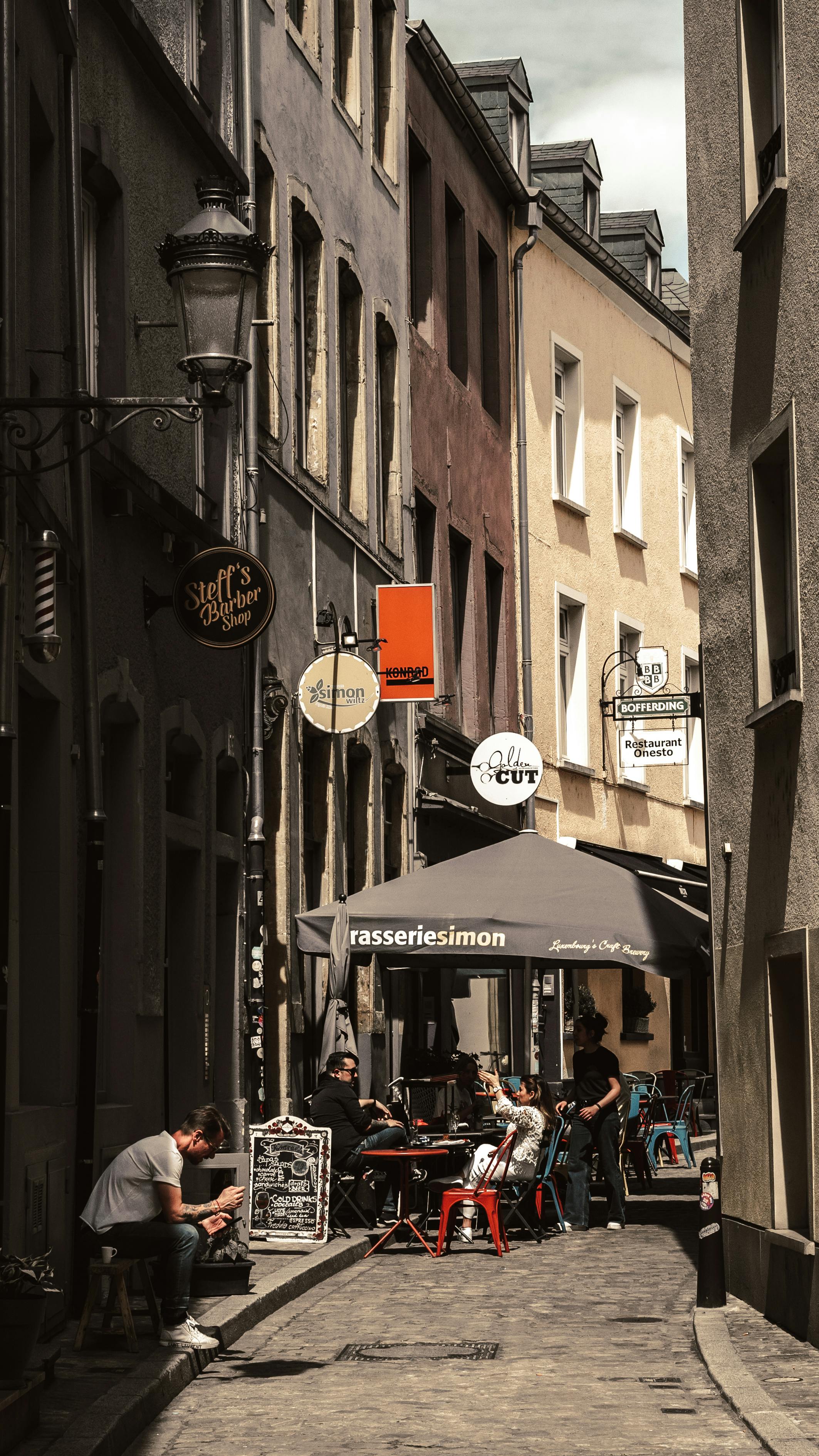 Restaurant on Narrow Street in Town · Free Stock Photo