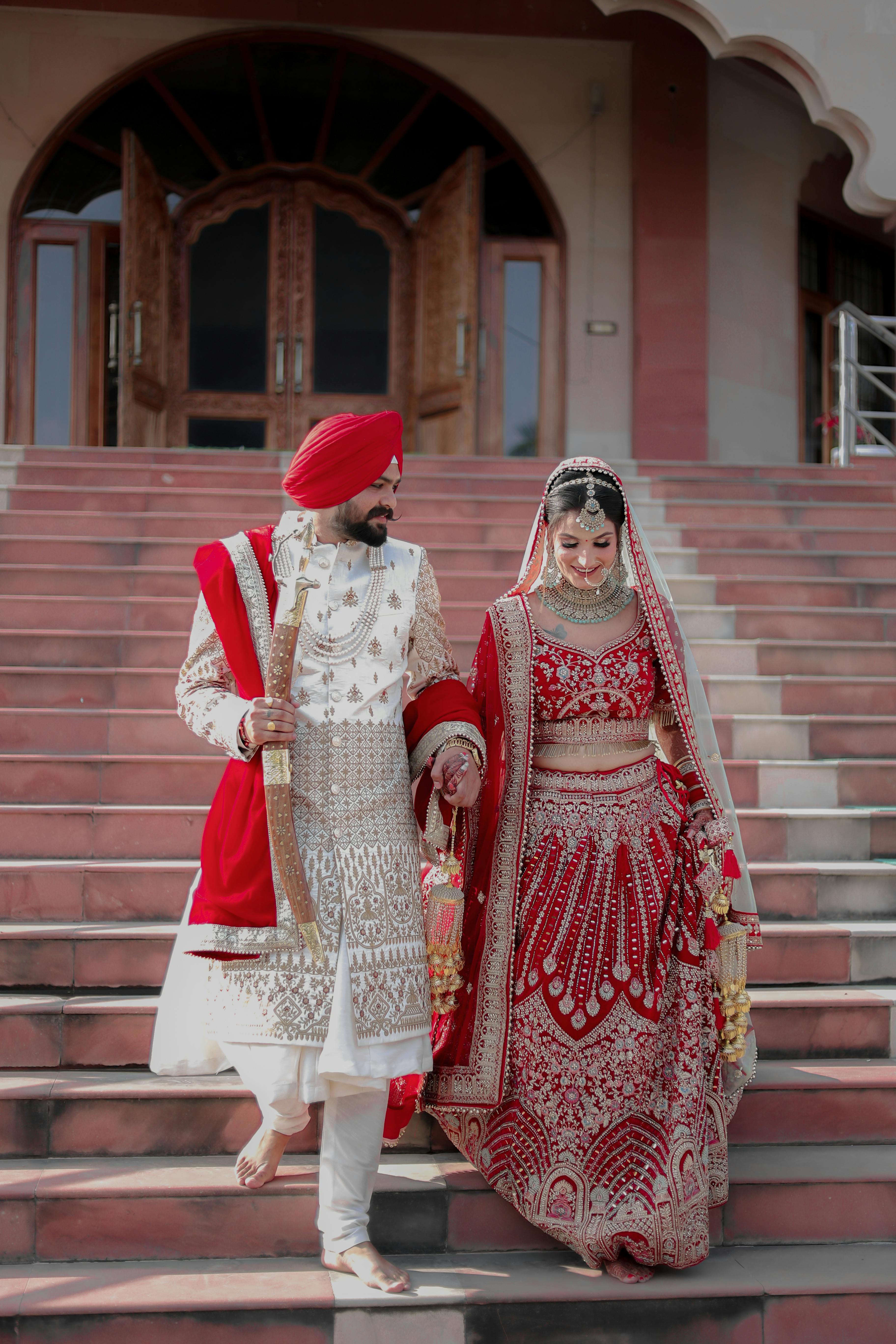 Newlywed Couple in Traditional Indian Wedding Attire Walking Down the ...
