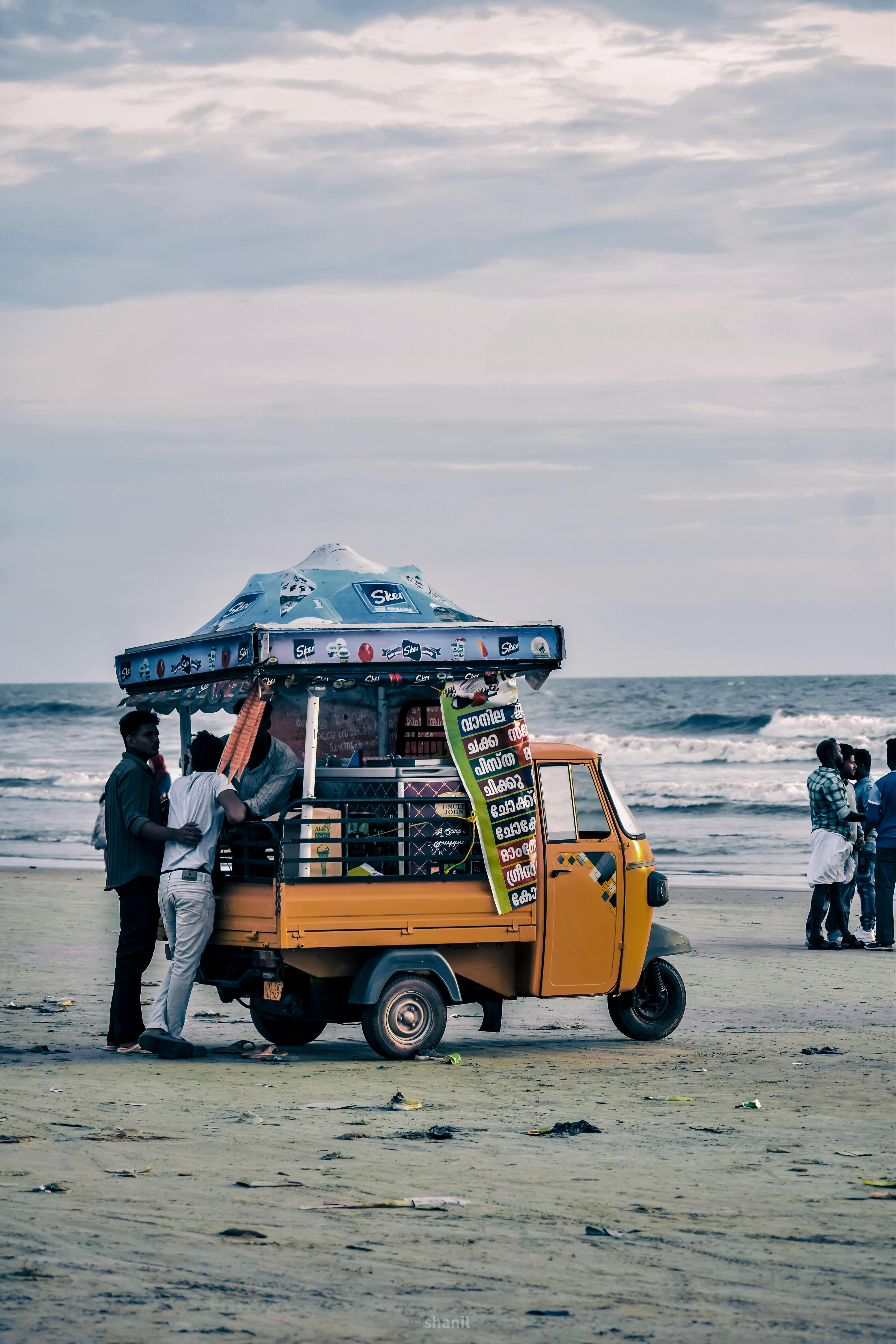 Customers at an Ice Cream Stand on an Auto Rickshaw by the Sea · Free ...