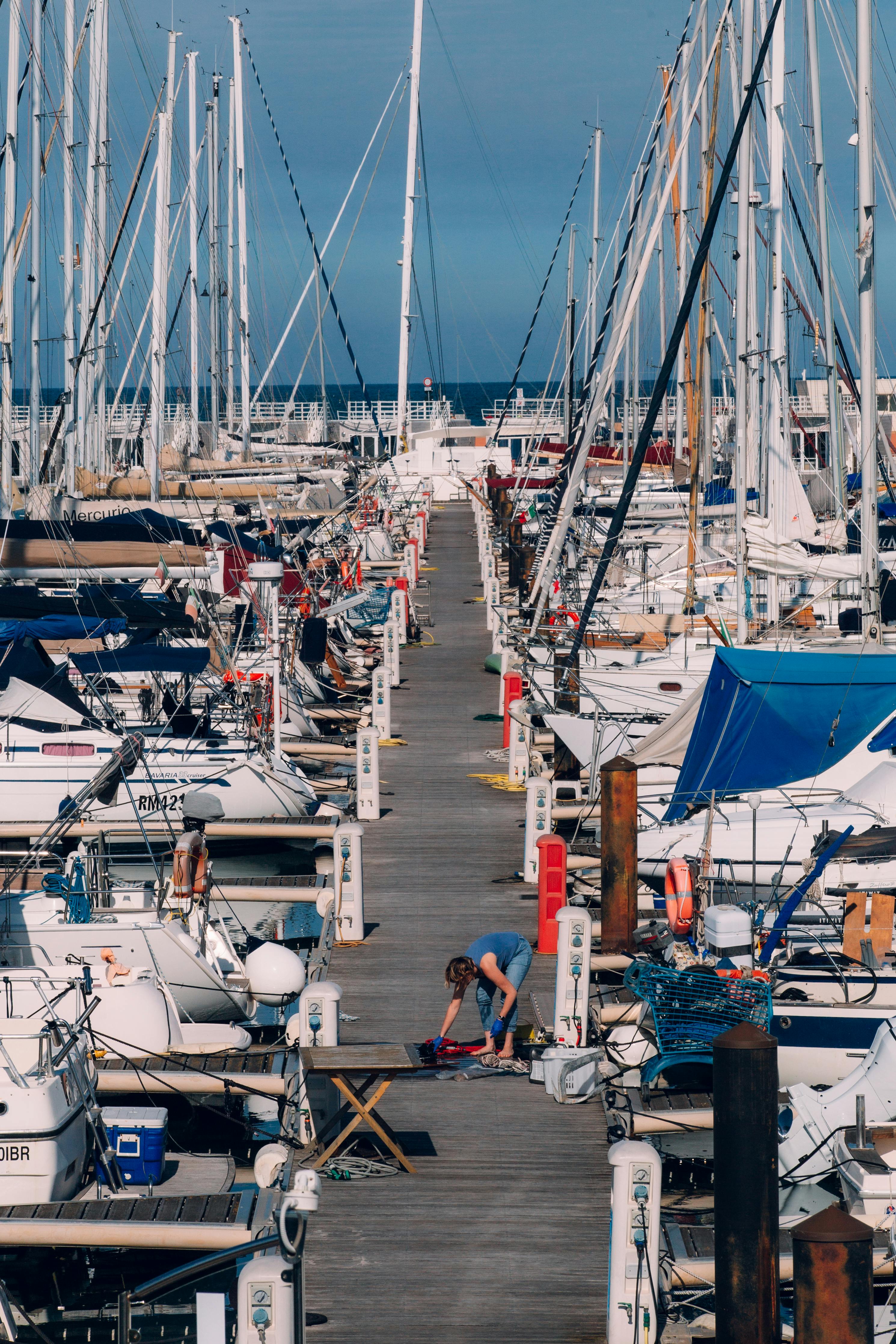 Tourist Packing on the Pier in the Marina Among Moored Boats · Free ...