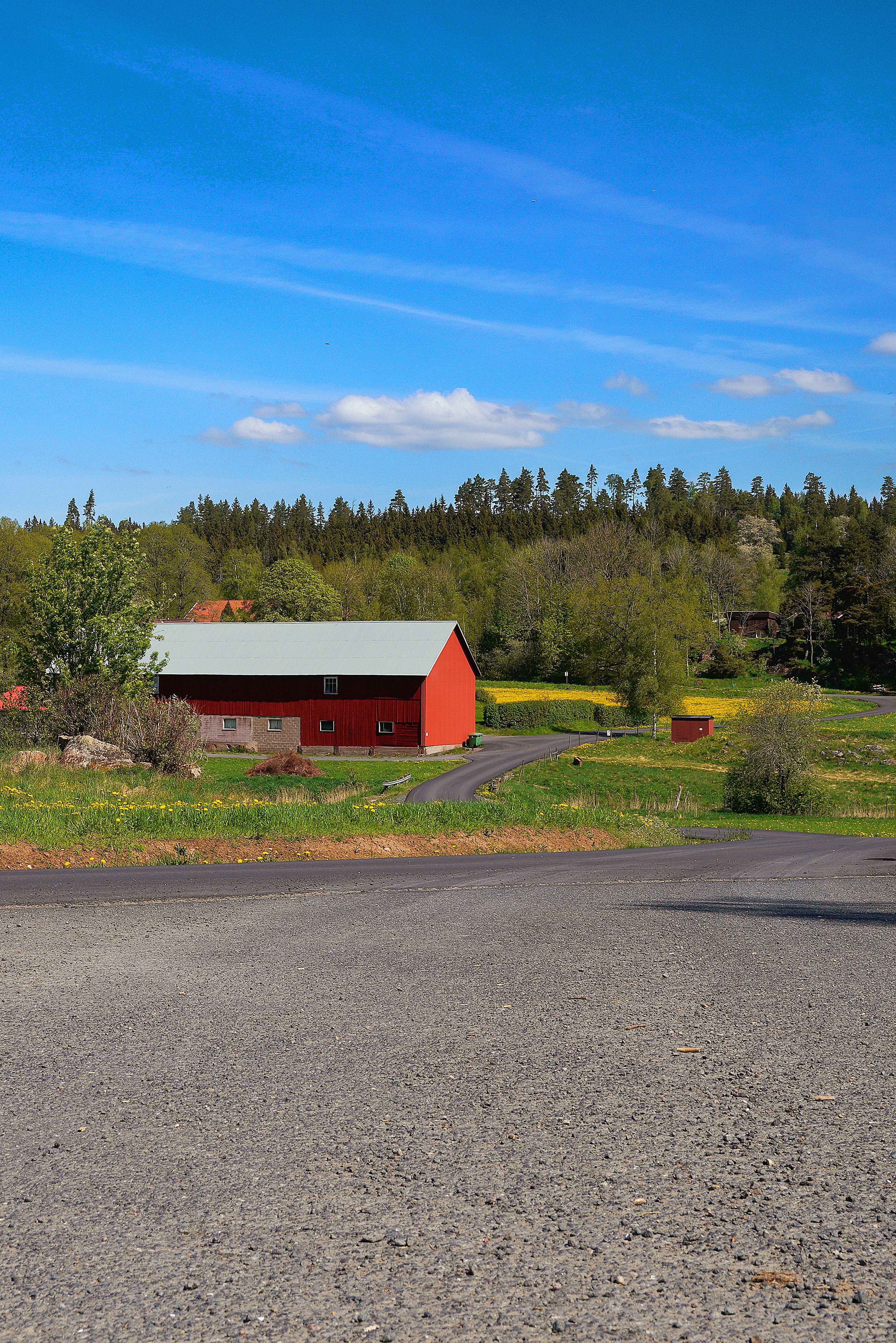 Photo of a Red Barn by the Road in the Countryside · Free Stock Photo