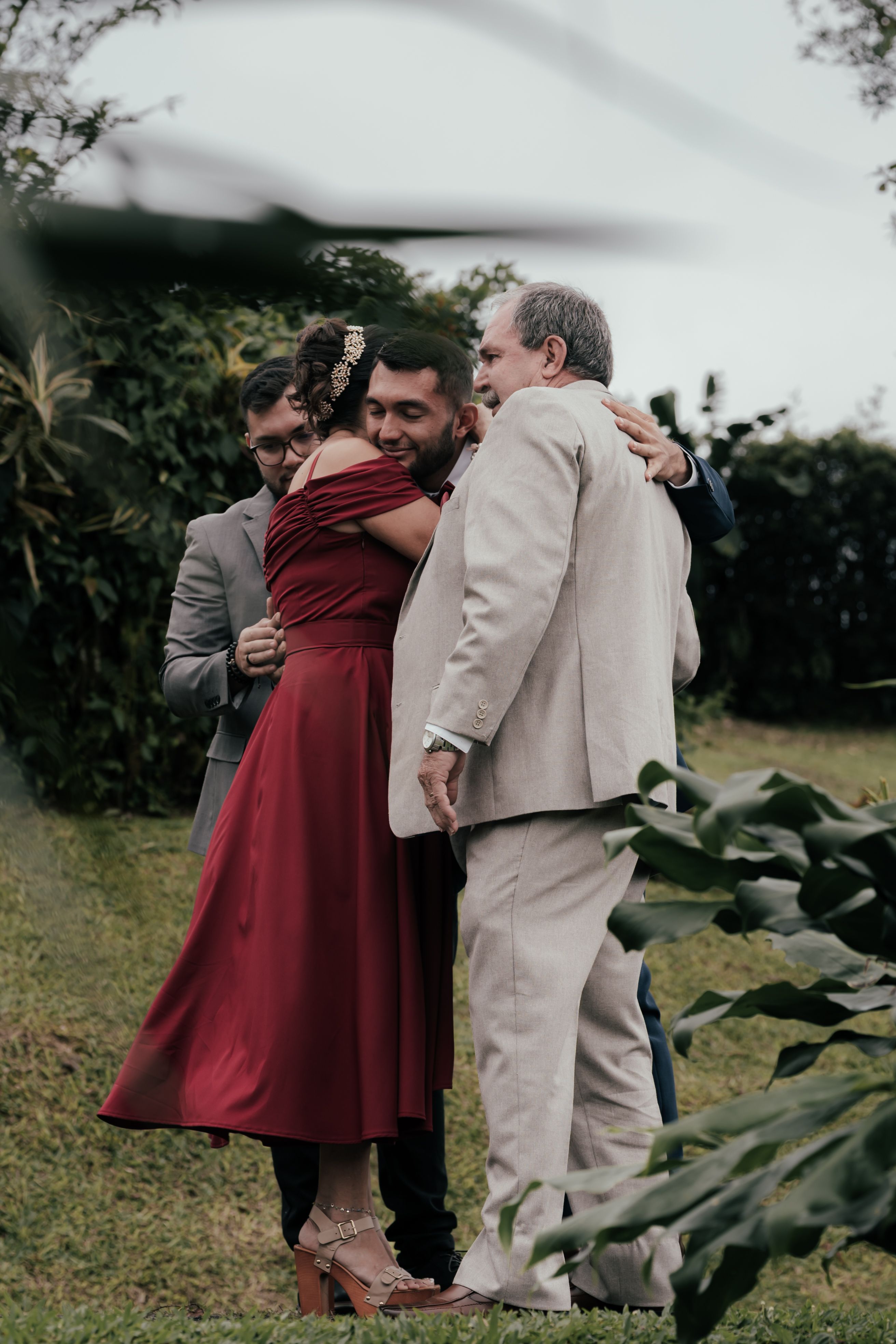 Wedding Guests Hugging the Groom in the Garden · Free Stock Photo
