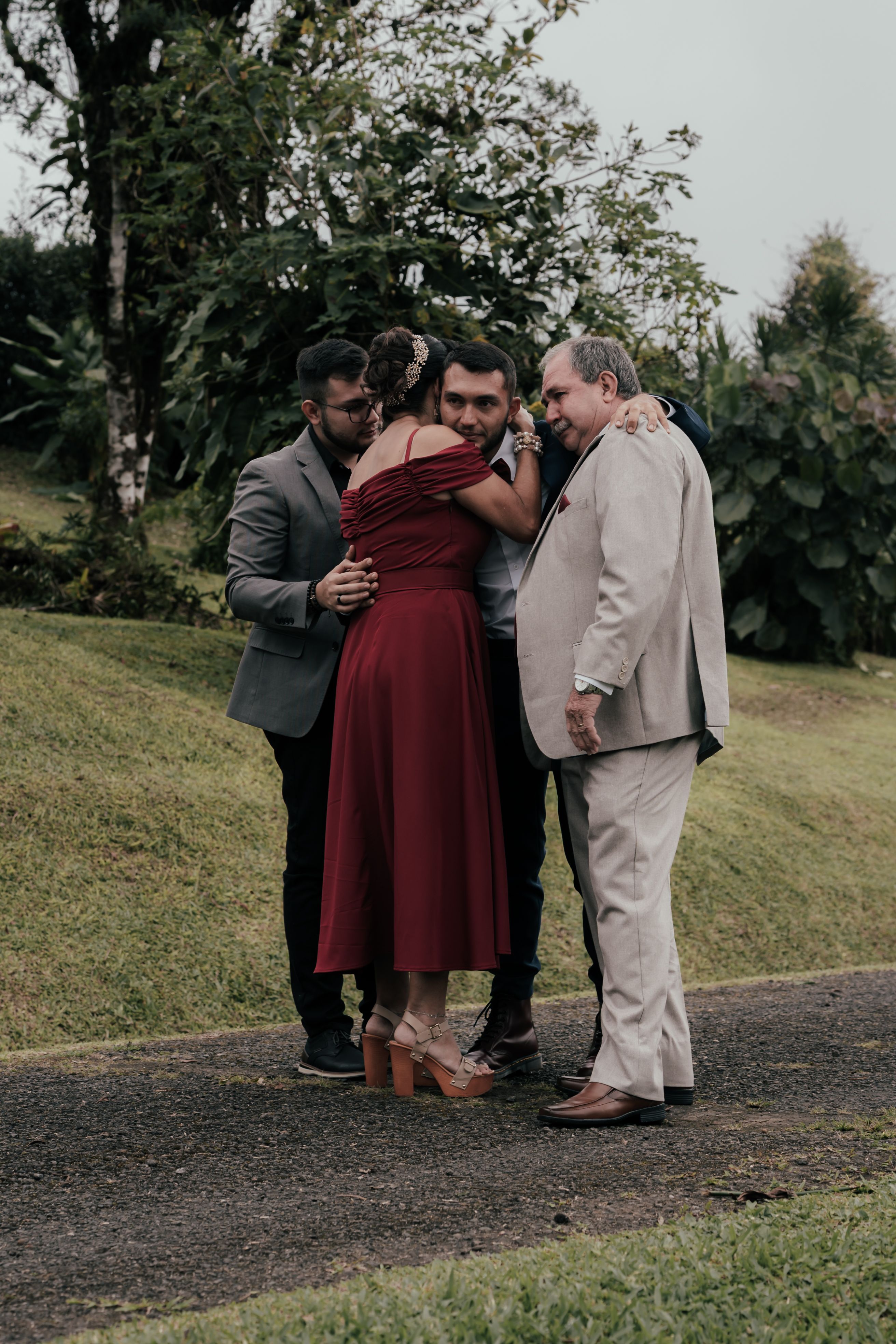 Wedding Guests Hugging the Groom in the Garden · Free Stock Photo