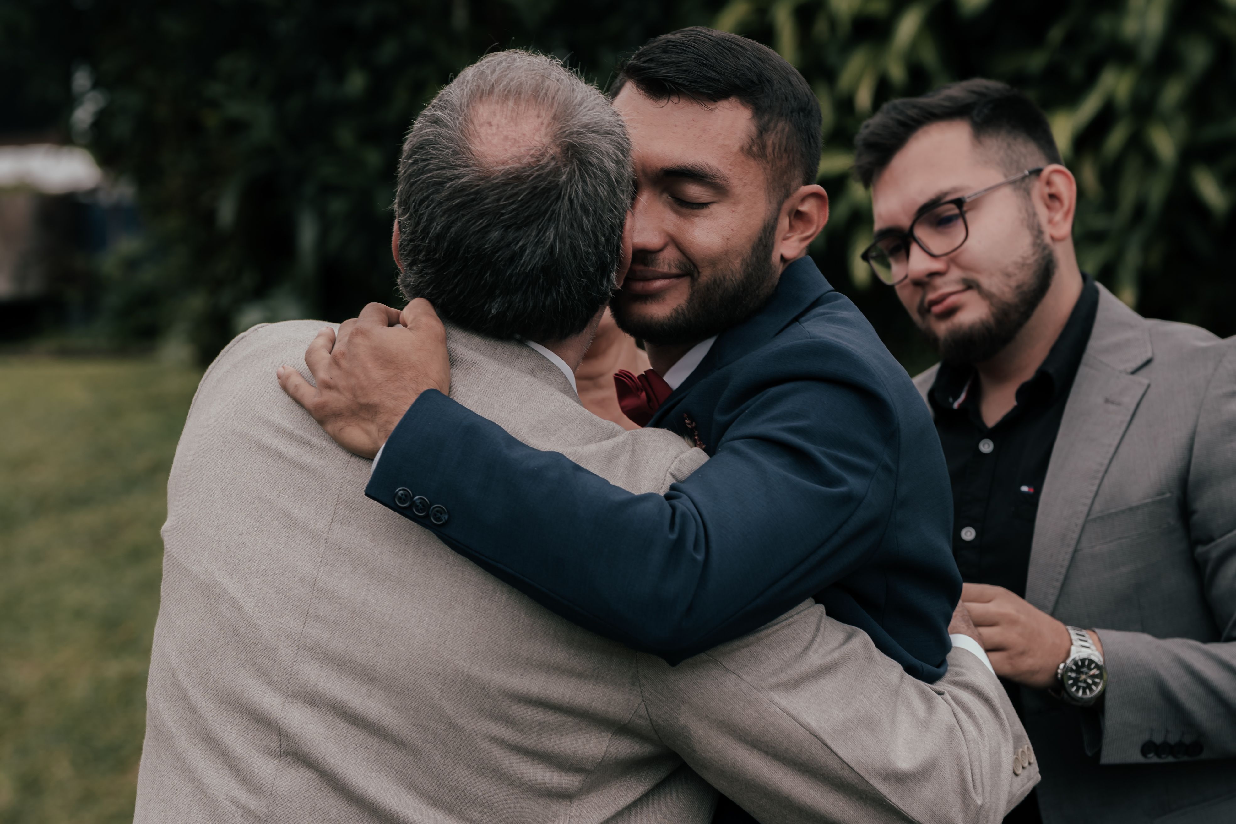 Wedding Guests Hugging the Groom in the Garden · Free Stock Photo