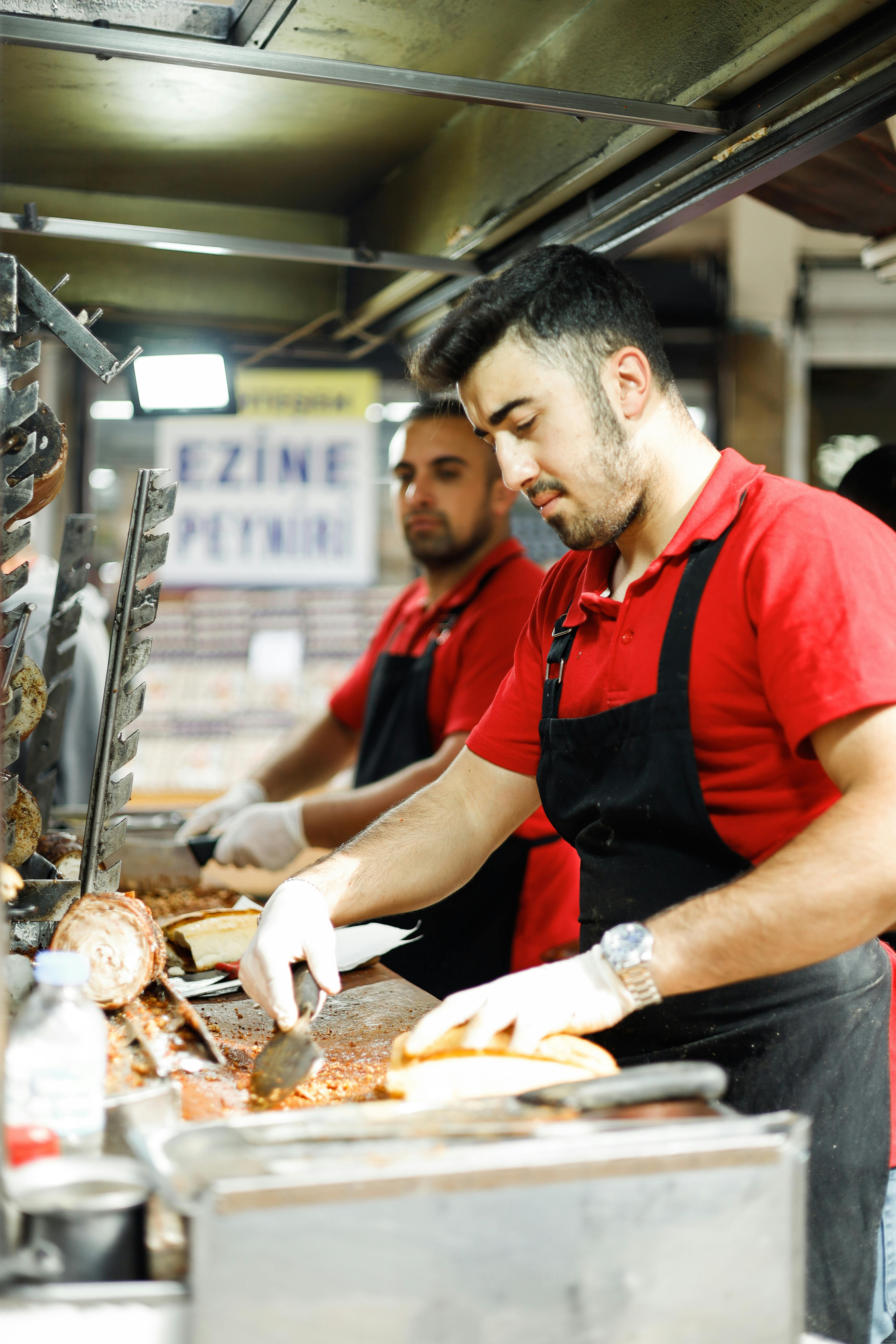 Two Men Preparing Food · Free Stock Photo