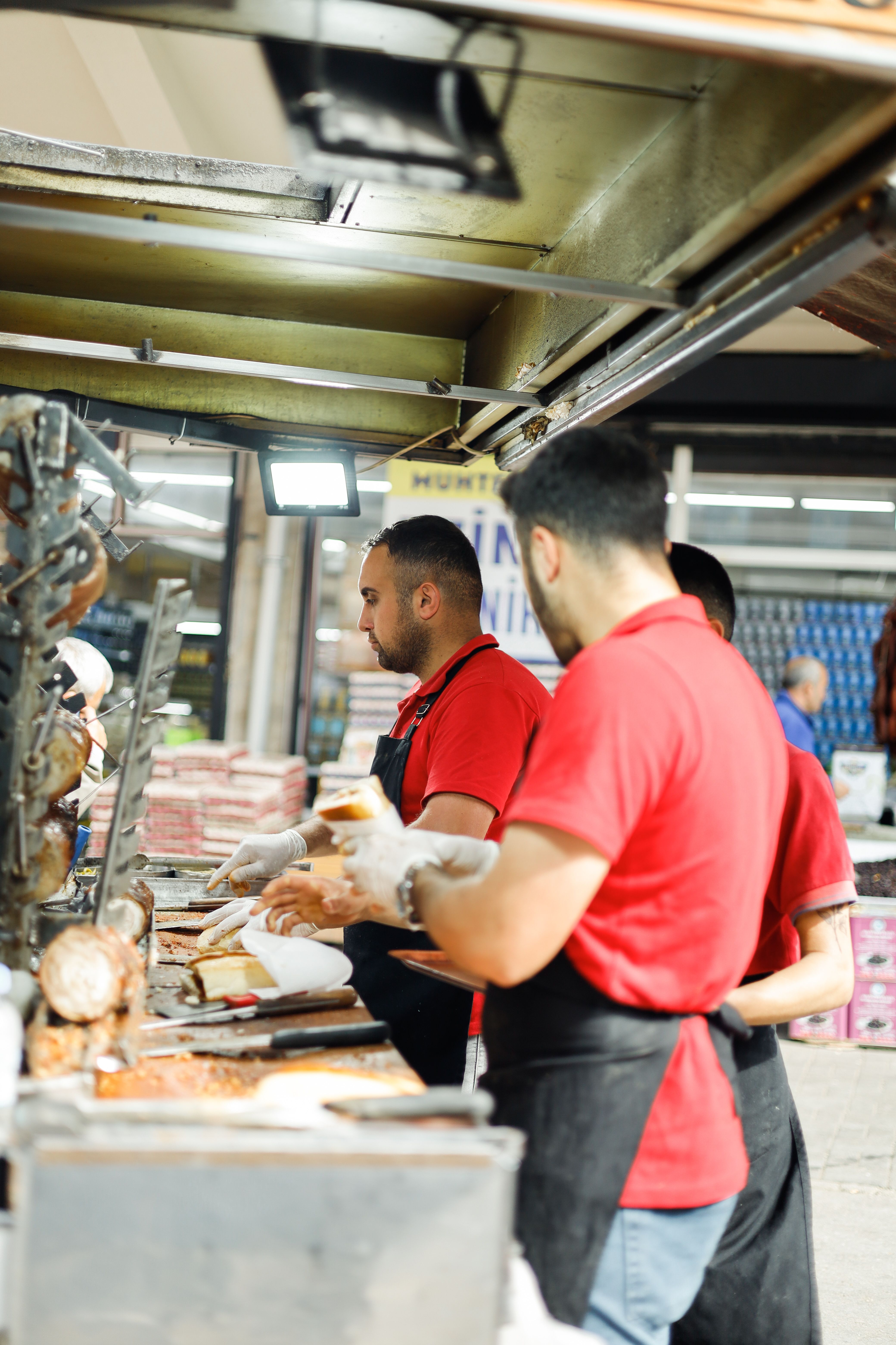 Men Preparing Food at Food Bar · Free Stock Photo