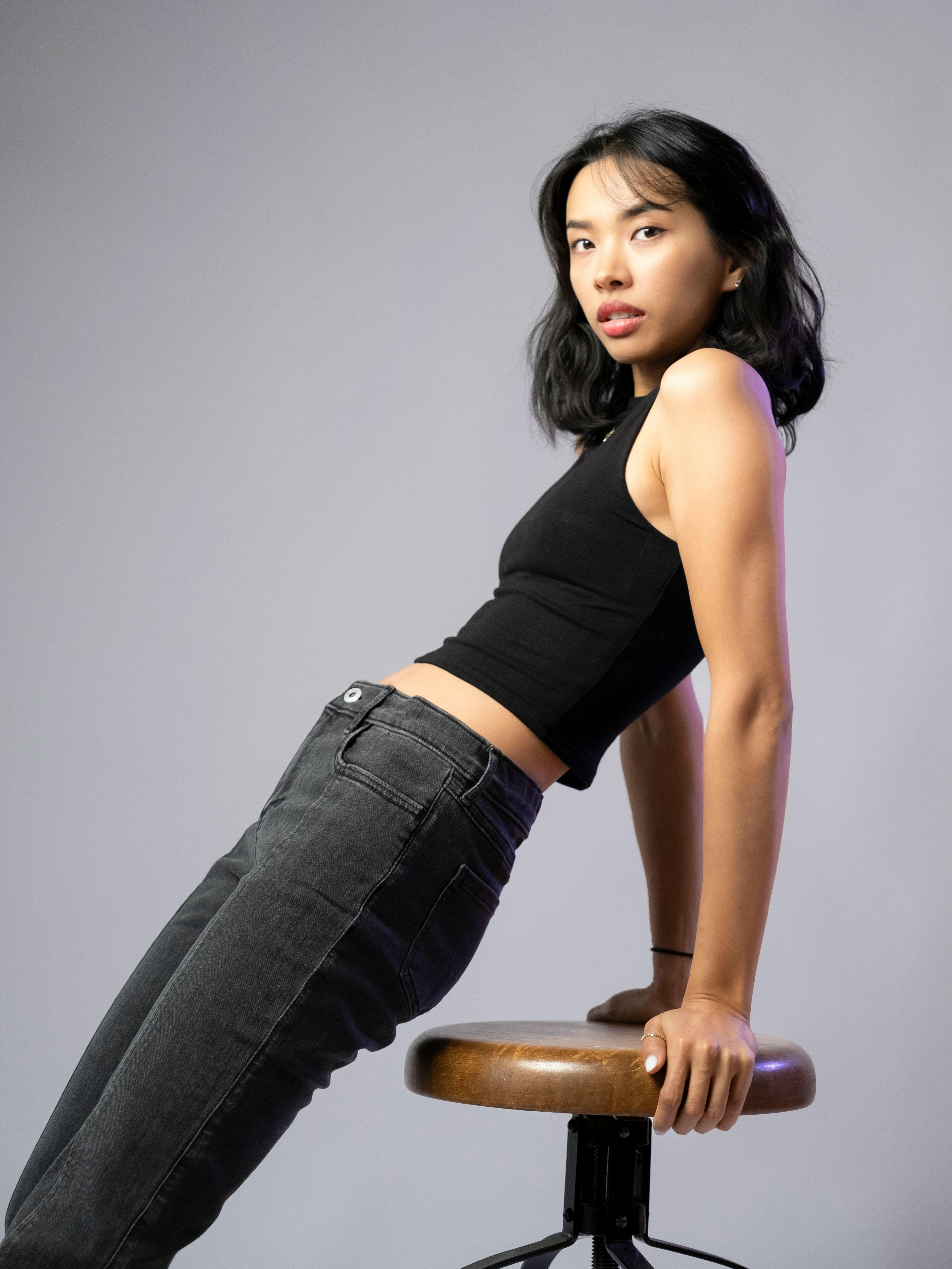 Woman Leaning on Chair · Free Stock Photo