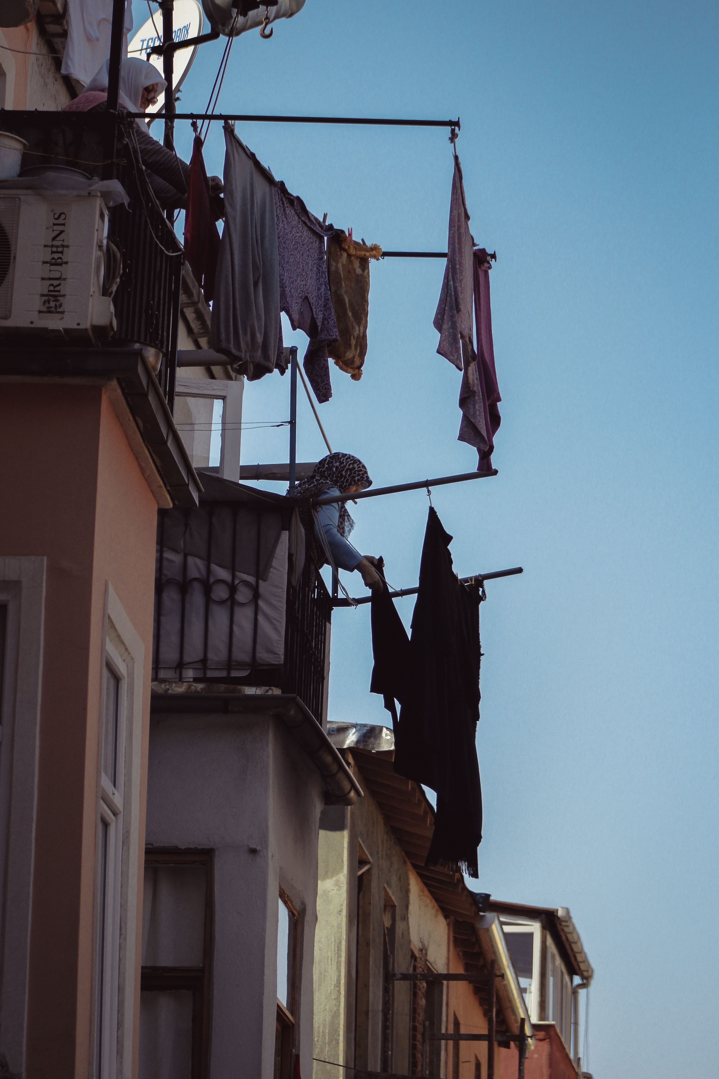 Woman Hanging Laundry · Free Stock Photo