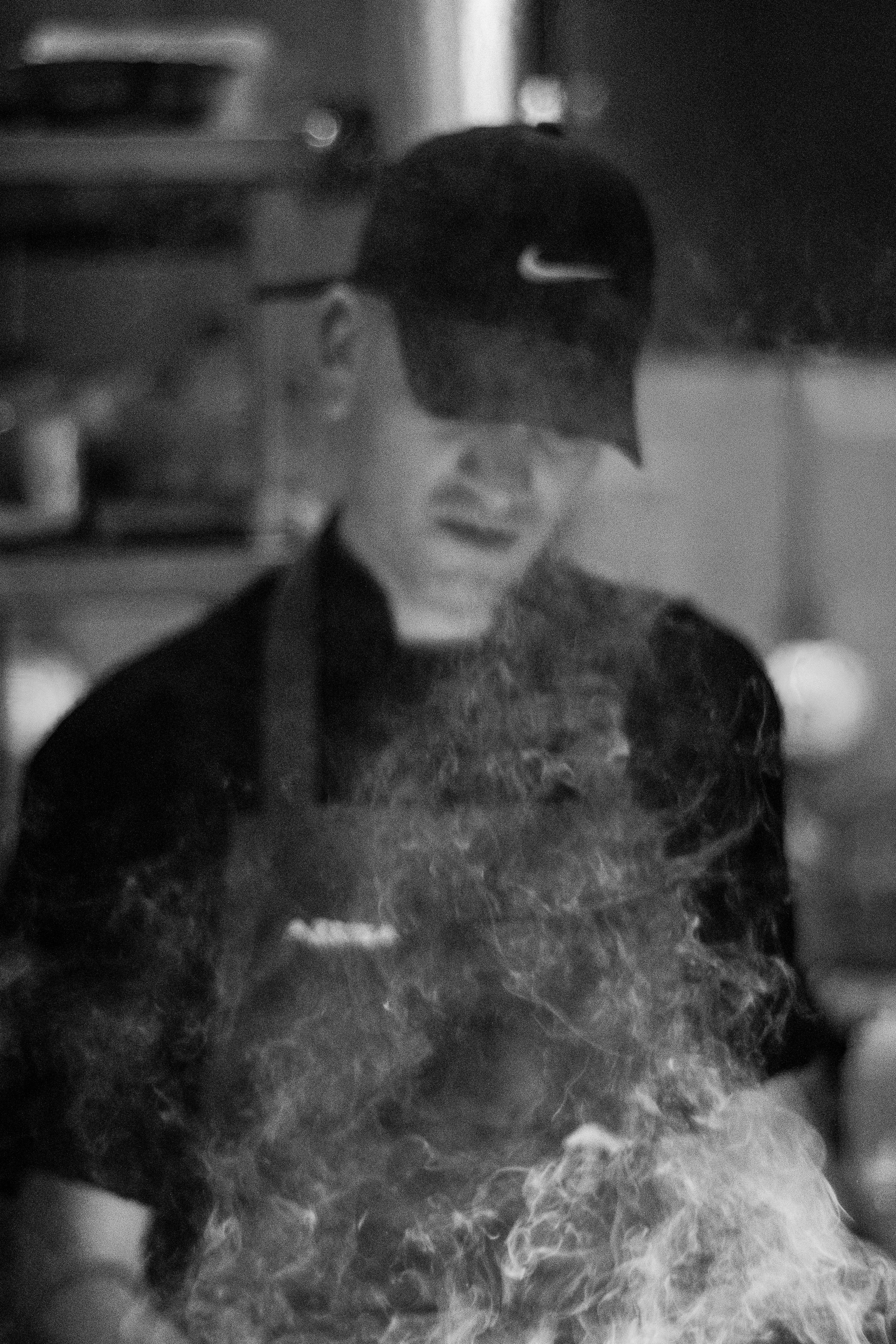 Man in Cap and Apron Cooking · Free Stock Photo